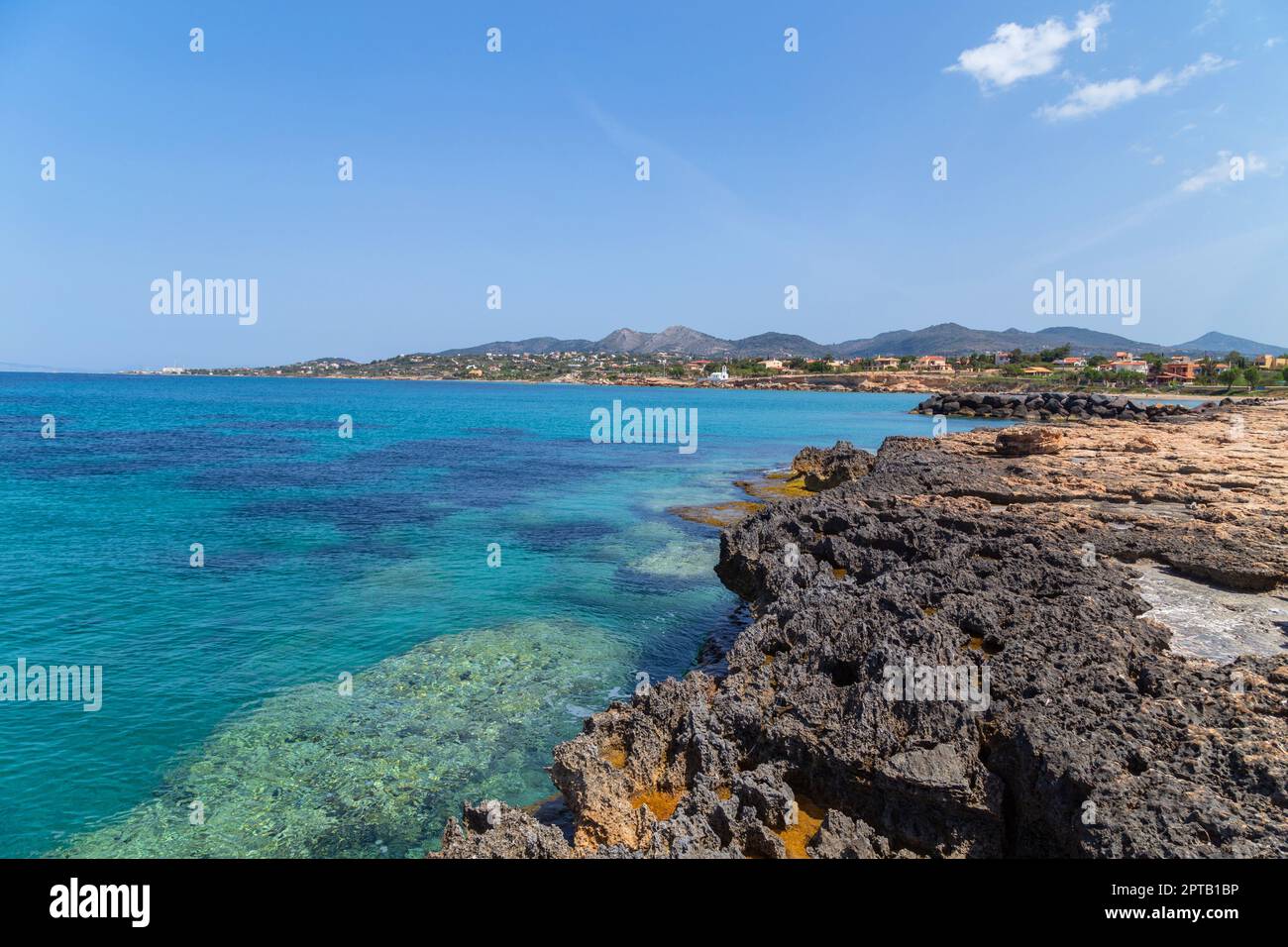 The coast of Aegina island with clear and blue waters of Mediterranean ...