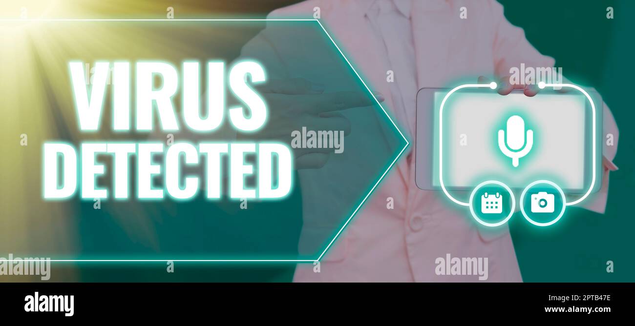 Hand writing sign Virus DetectedA computer program used to prevent and ...