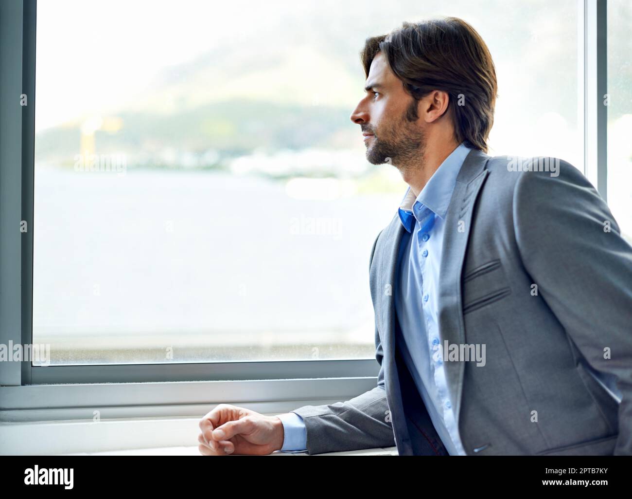 Thinking over corporate decisions. Cropped view of a businessman ...