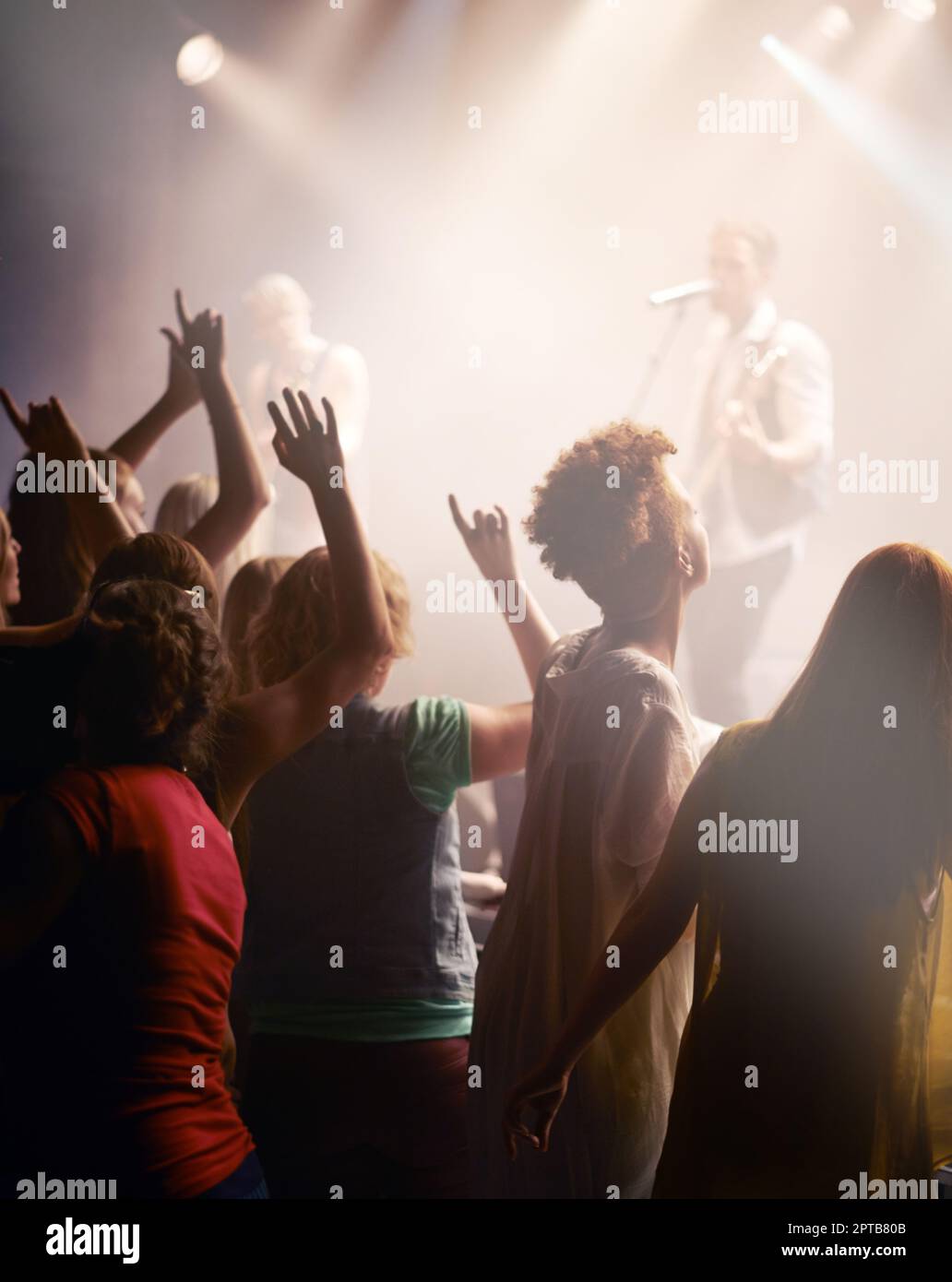 Theyve got thousands of fans. fans enjoying a rock show Stock Photo - Alamy
