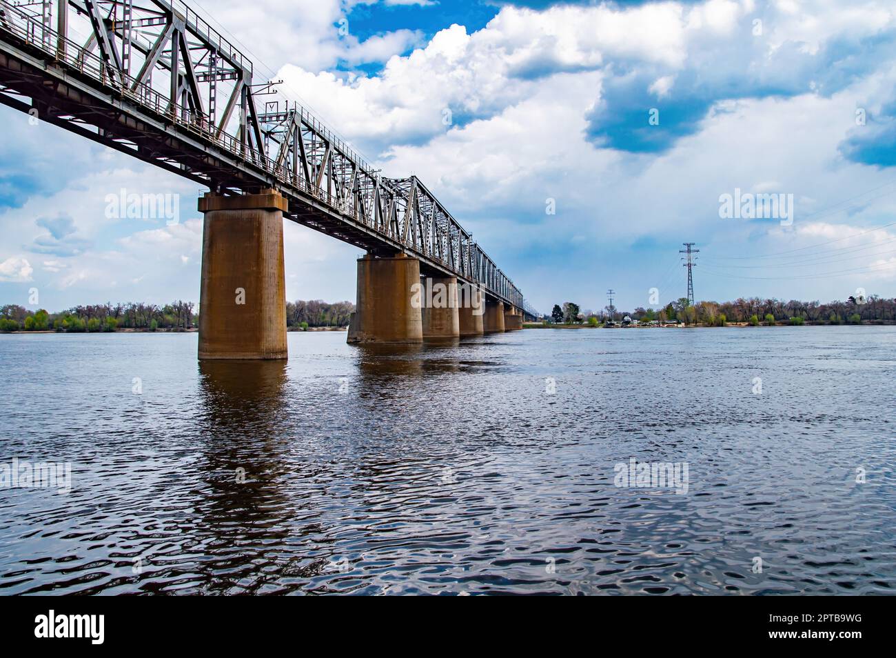 Concrete supports of the railway bridge over the river. Water crossing ...