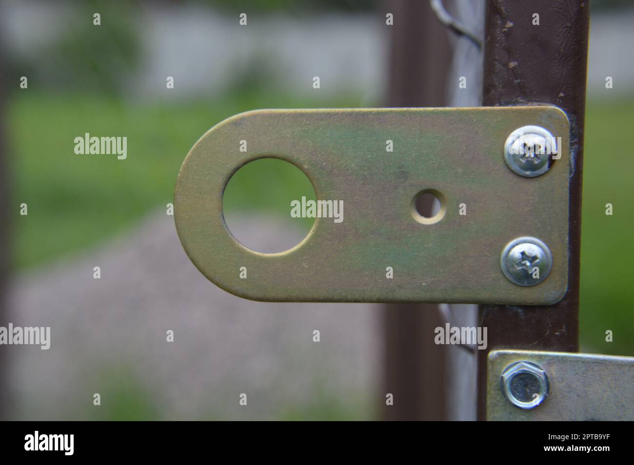 Installing fasteners for installing a he padlock Stock Photo - Alamy