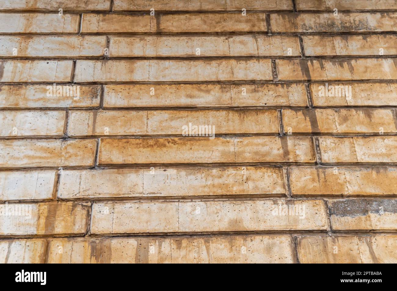 The texture of the wall of concrete blocks with traces of rust. Block ...