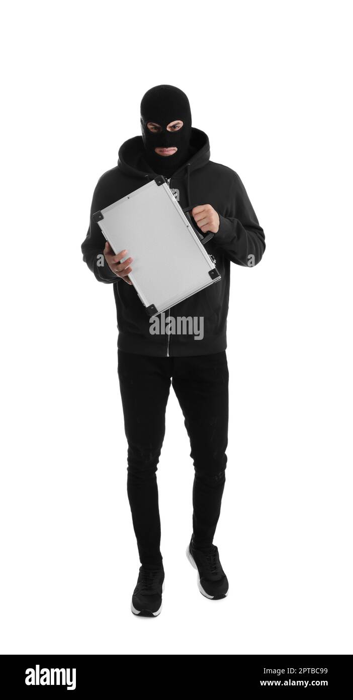 Man wearing black balaclava with metal briefcase on white background ...