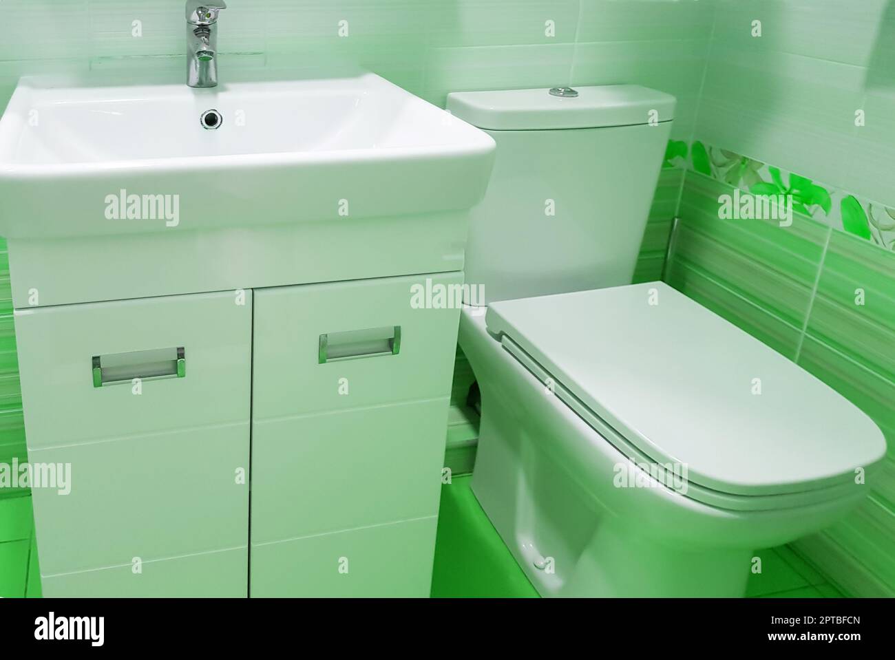 Close-up of the washbasin and toilet bowl in a modern beautiful ...