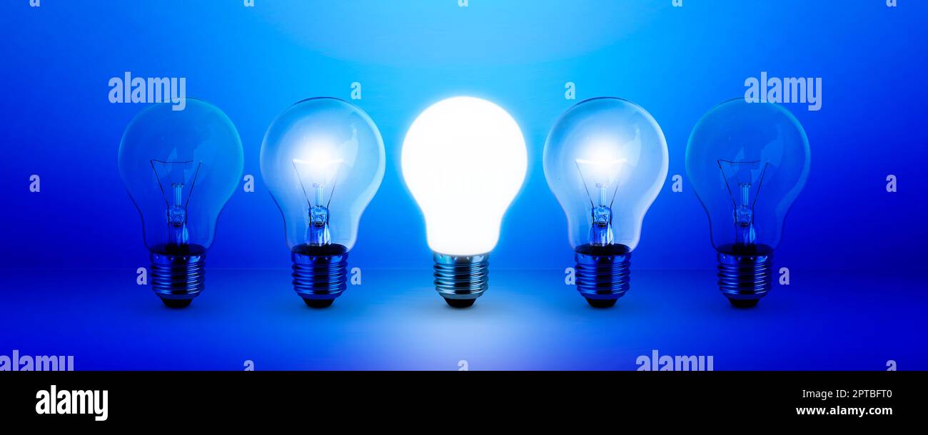 light bulb on blue background idea concept Stock Photo - Alamy