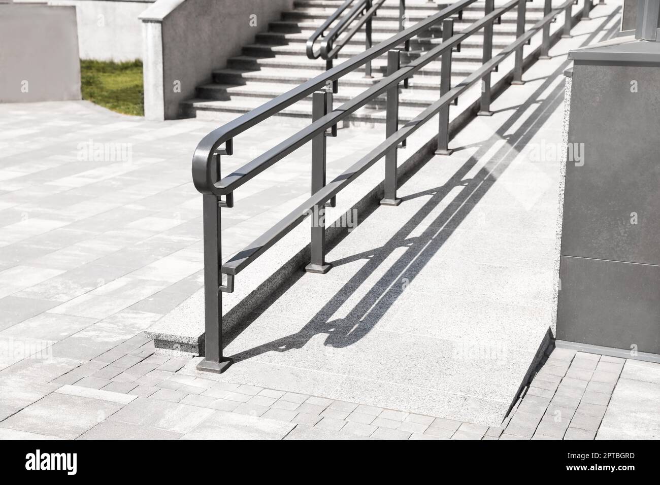 Outdoor stairs with ramp and metal railing Stock Photo - Alamy