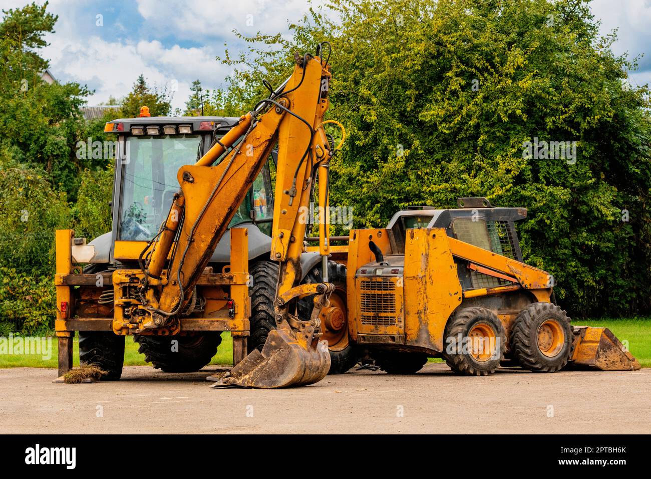 Couple of heavy industrial machinery equipment at construction site ...