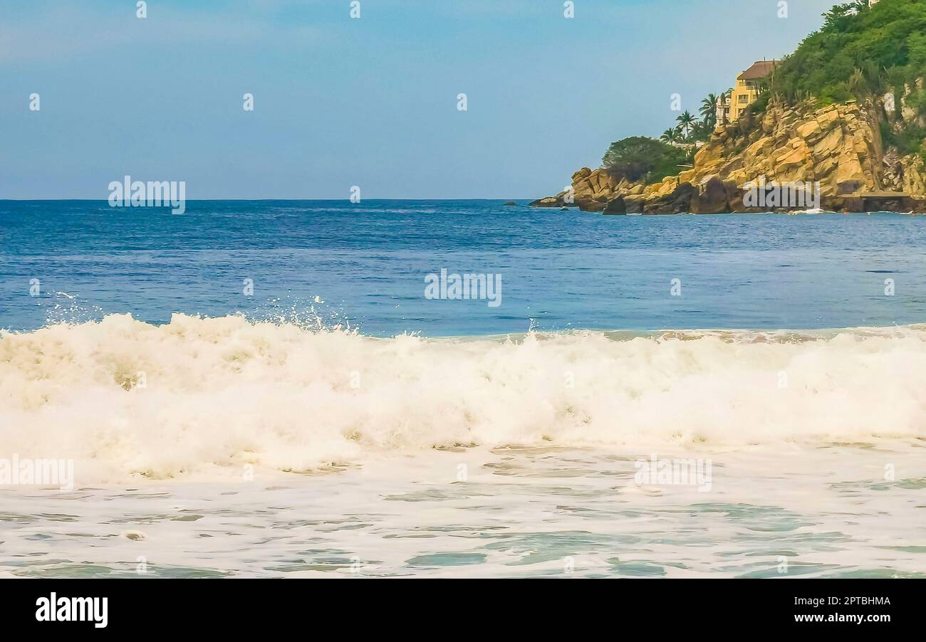 Extremely huge big surfer waves with cliffs rocks boulders stones at ...