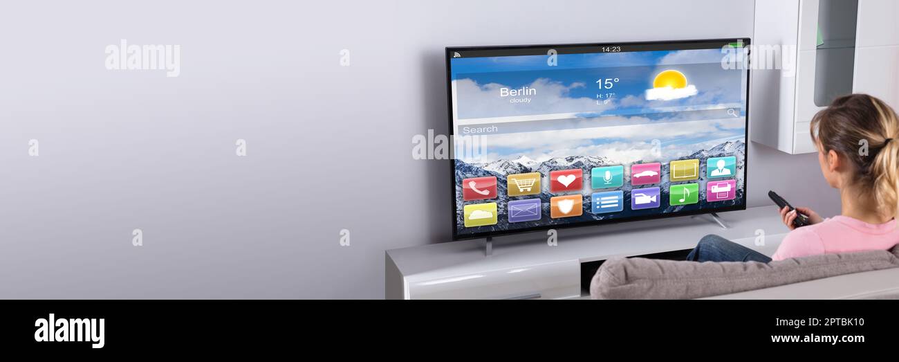 Watching TV In Living Room. Woman Watching Television On Couch Stock ...