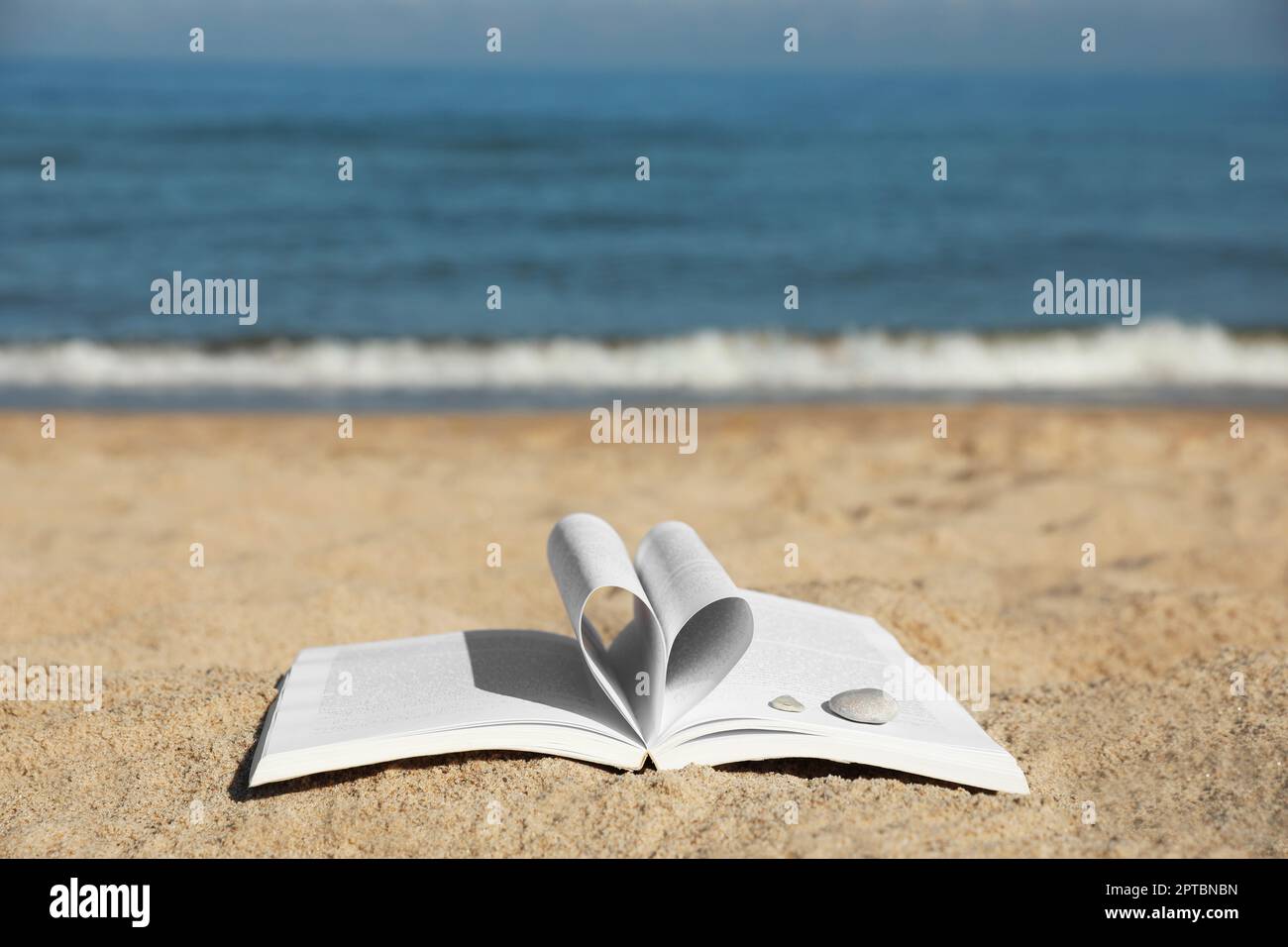 Book on beach with sea in background hi-res stock photography and ...