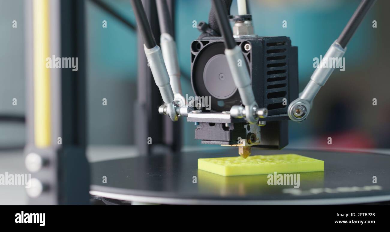 3D Printing Machine printing a piece of plastic Stock Photo - Alamy