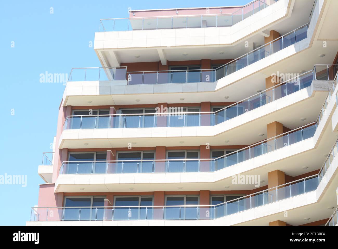Exterior of beautiful residential building with balconies, low angle ...