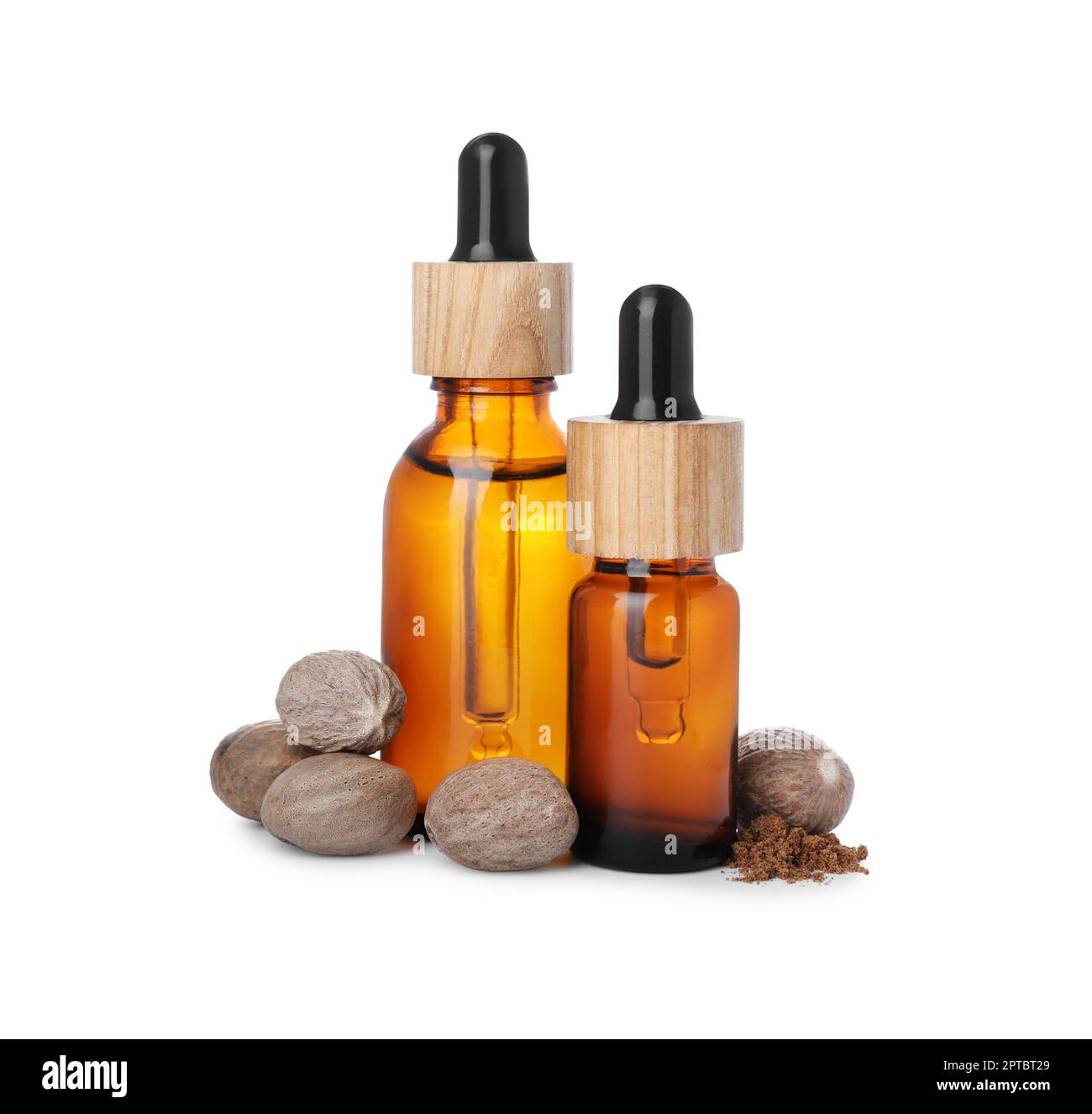 Bottles of nutmeg oil, nuts and powder on white background Stock Photo ...