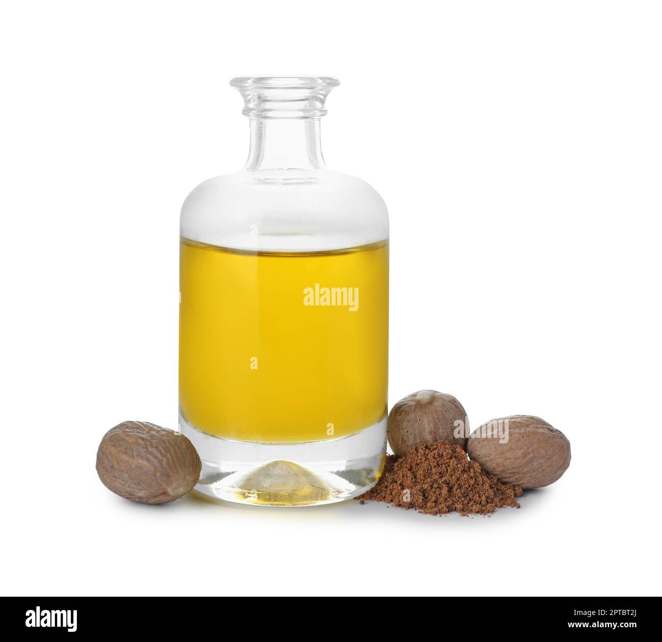 Bottle of nutmeg oil, nuts and powder on white background Stock Photo ...