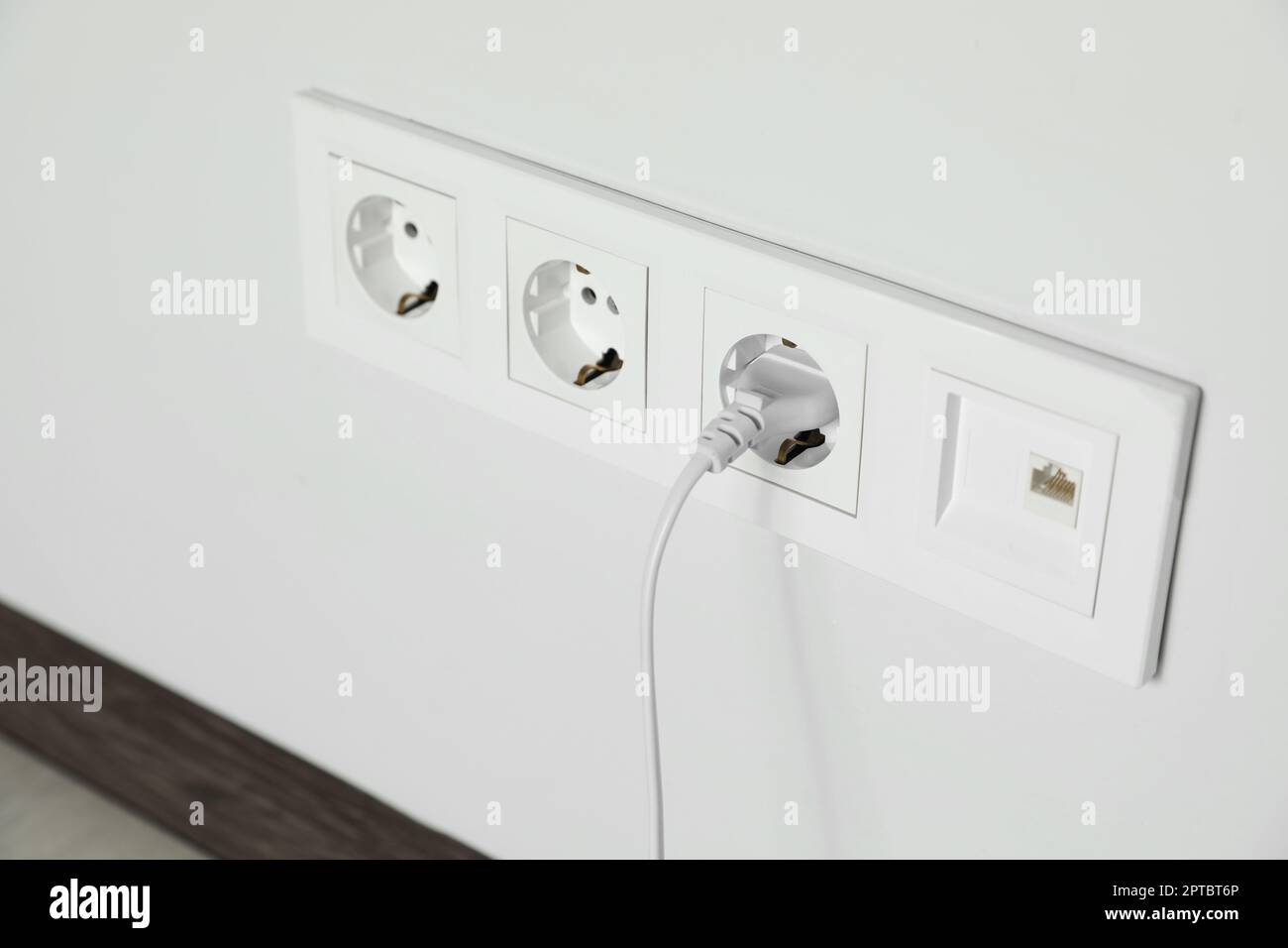 Power sockets inserted plug hi-res stock photography and images - Alamy