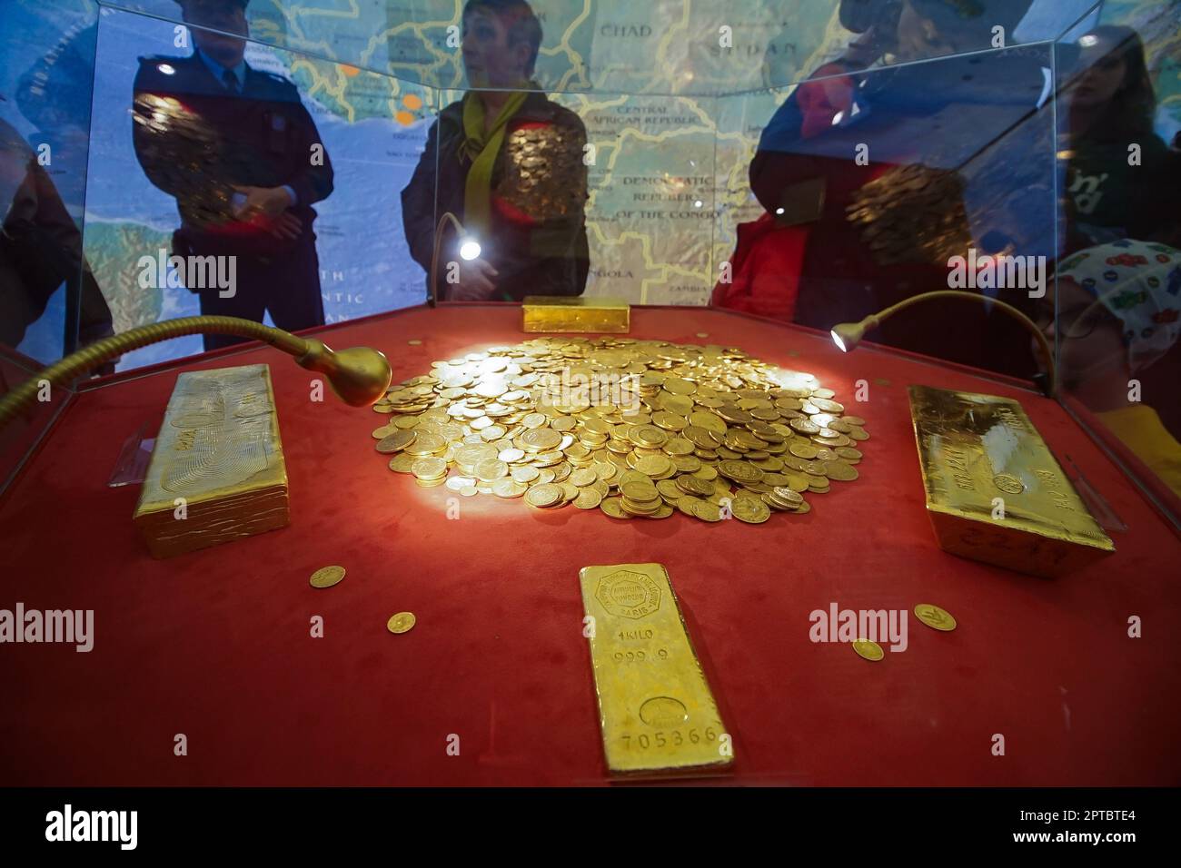 Bucharest, Romania. 27th Apr, 2023: Visitors look at gold bars and ...