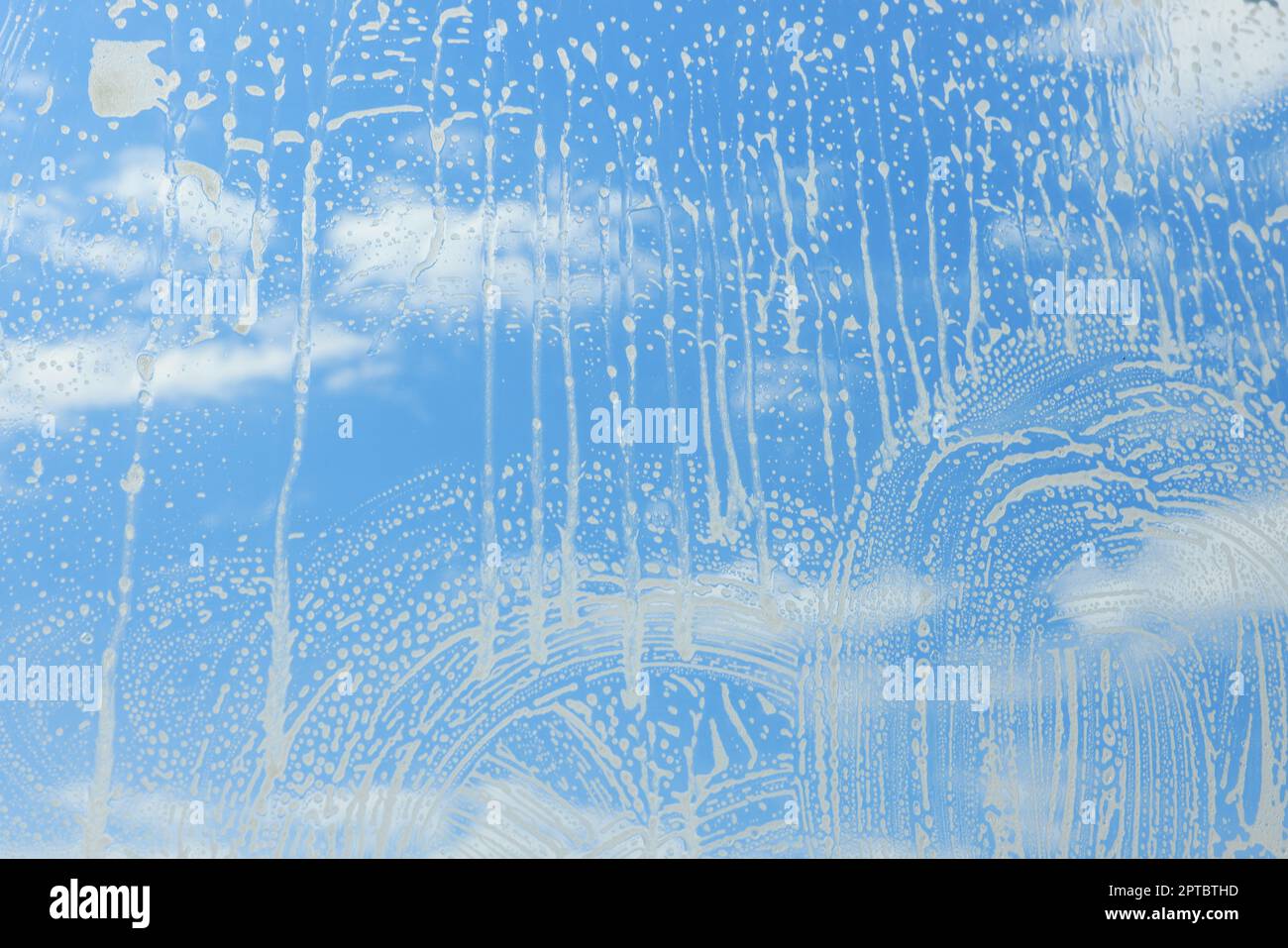 Cleaning foam on window glass, closeup view Stock Photo - Alamy
