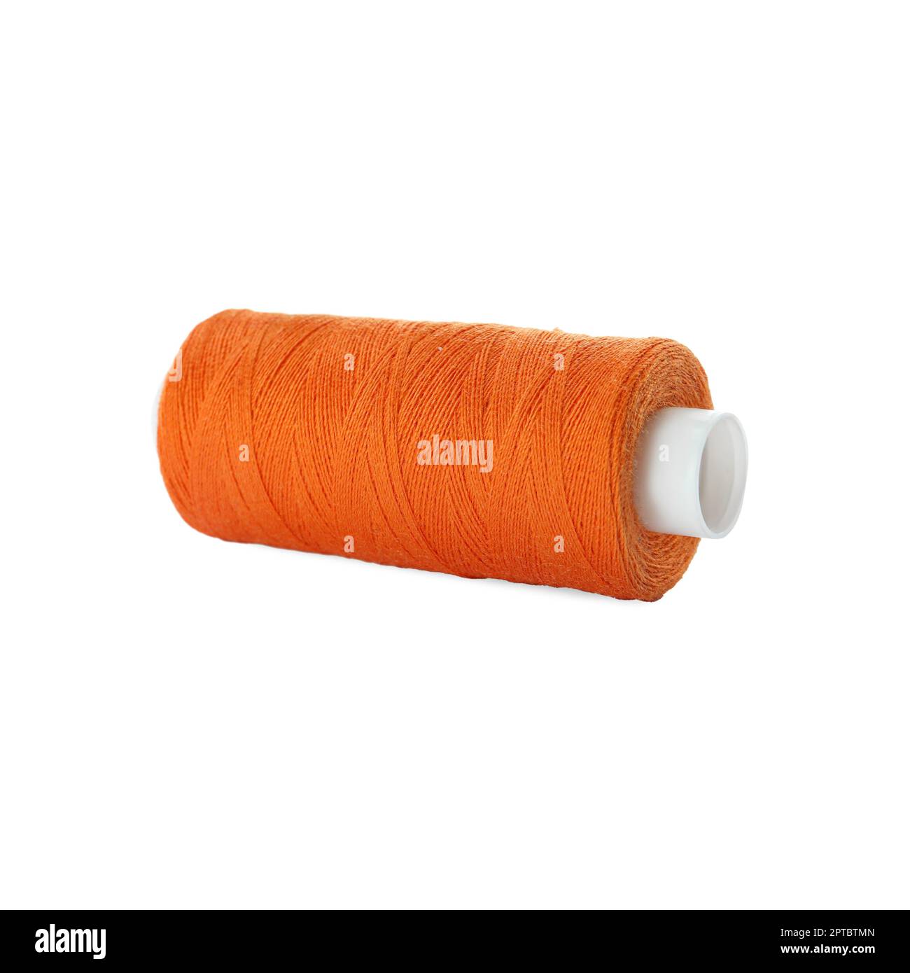 Spool of orange sewing thread isolated on white Stock Photo - Alamy