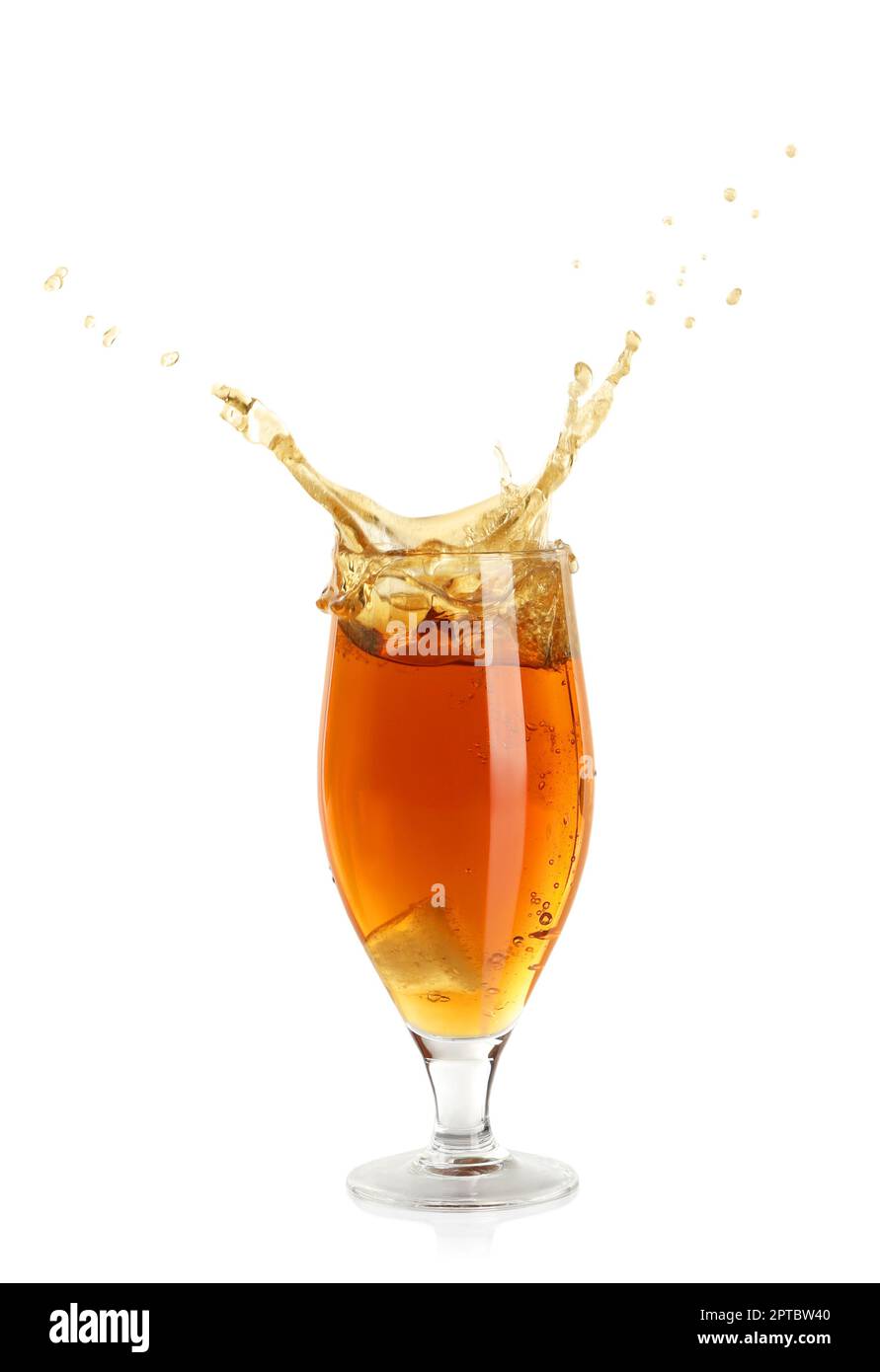 Beer splashing out of glass on white background Stock Photo - Alamy
