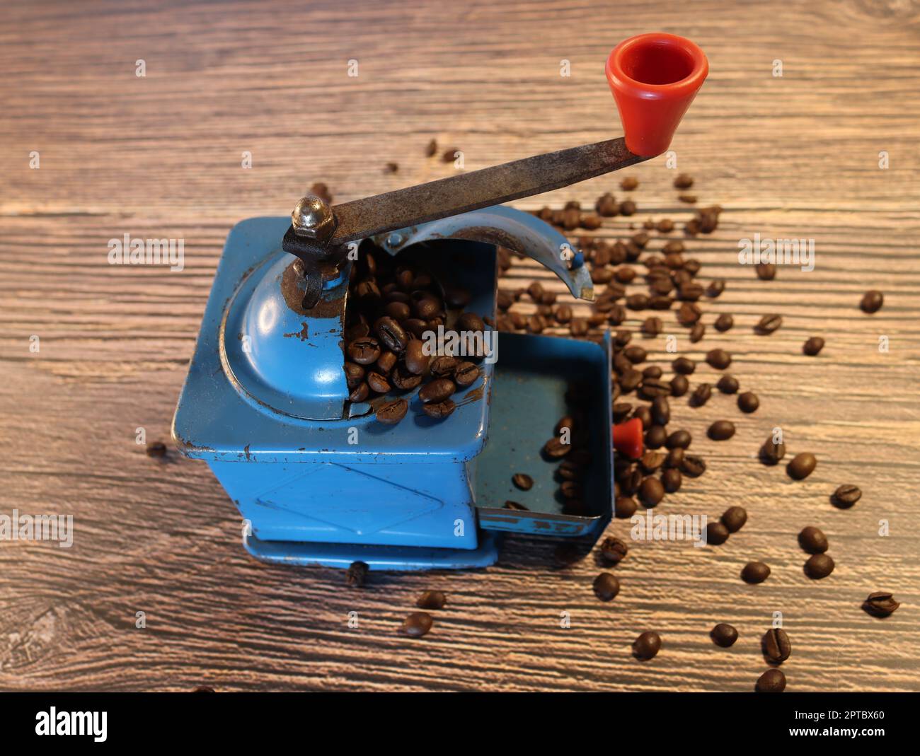 Grinding machine coffee beans old manual metal grinder Stock Photo - Alamy