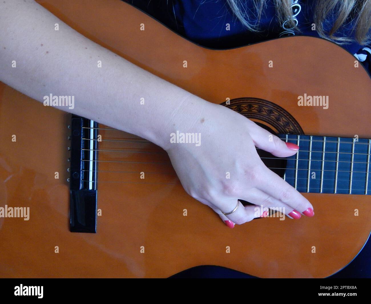 Playing hands on guitar music Stock Photo - Alamy