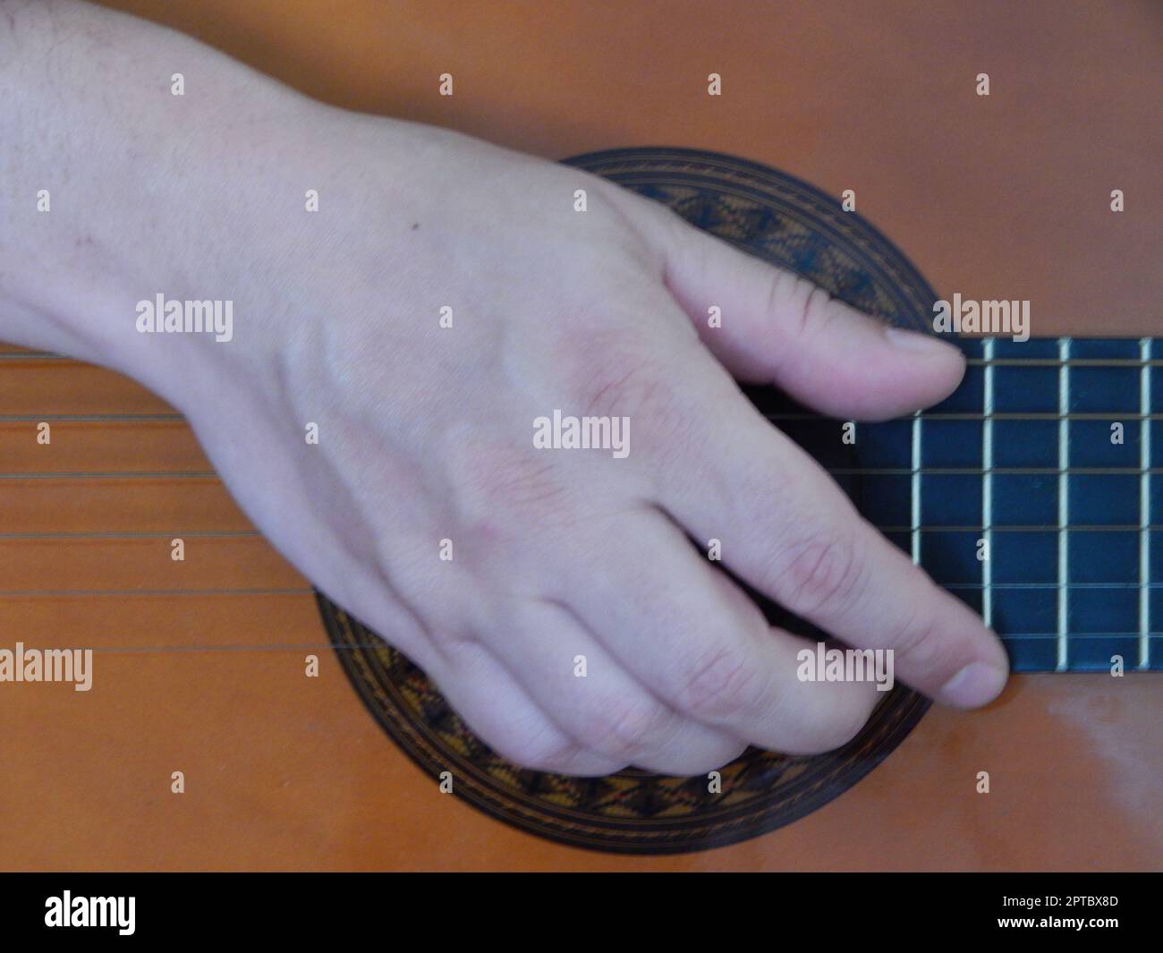 Playing hands on guitar music Stock Photo - Alamy