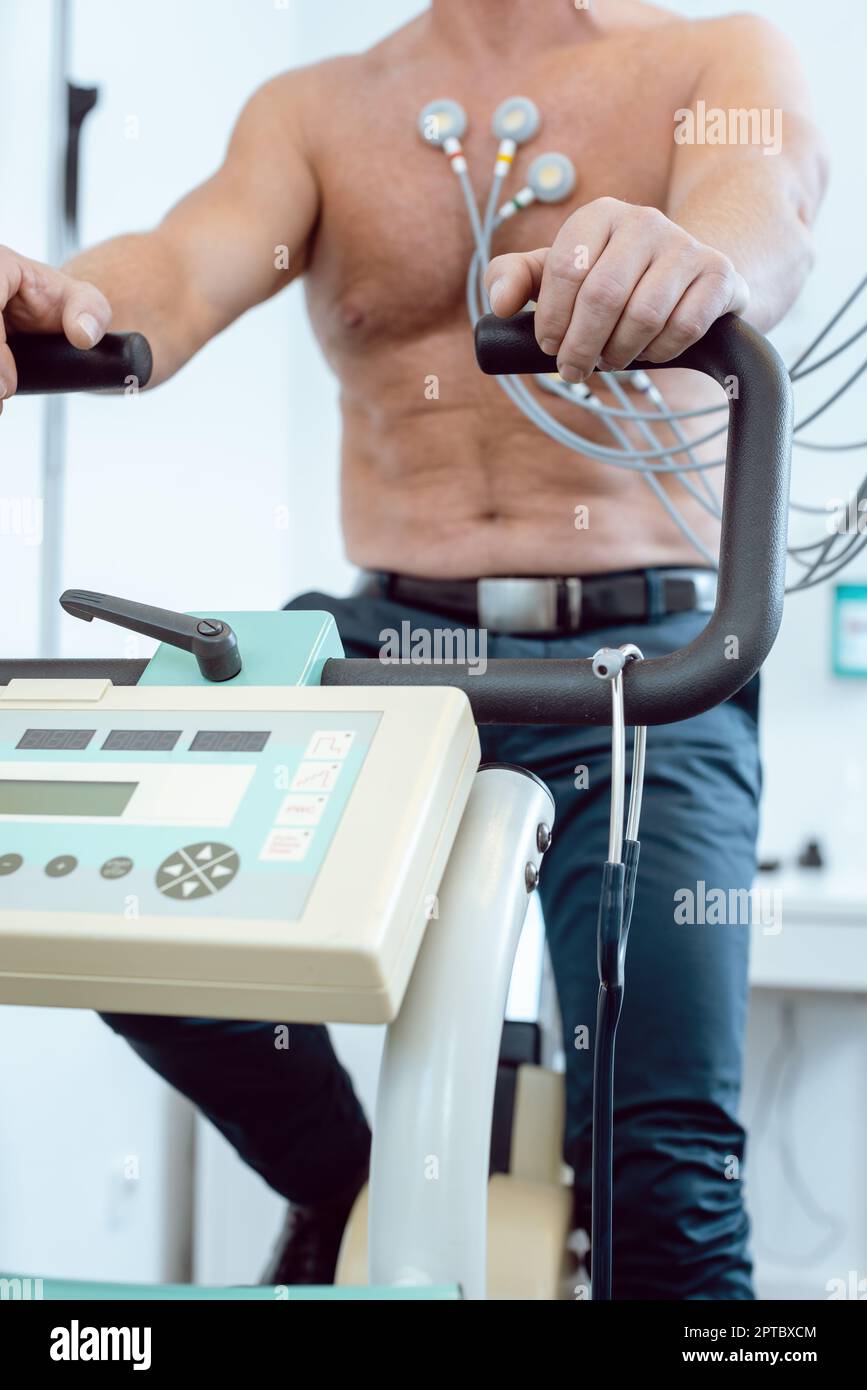 Patient during exercise ECG on stationary bike Stock Photo - Alamy