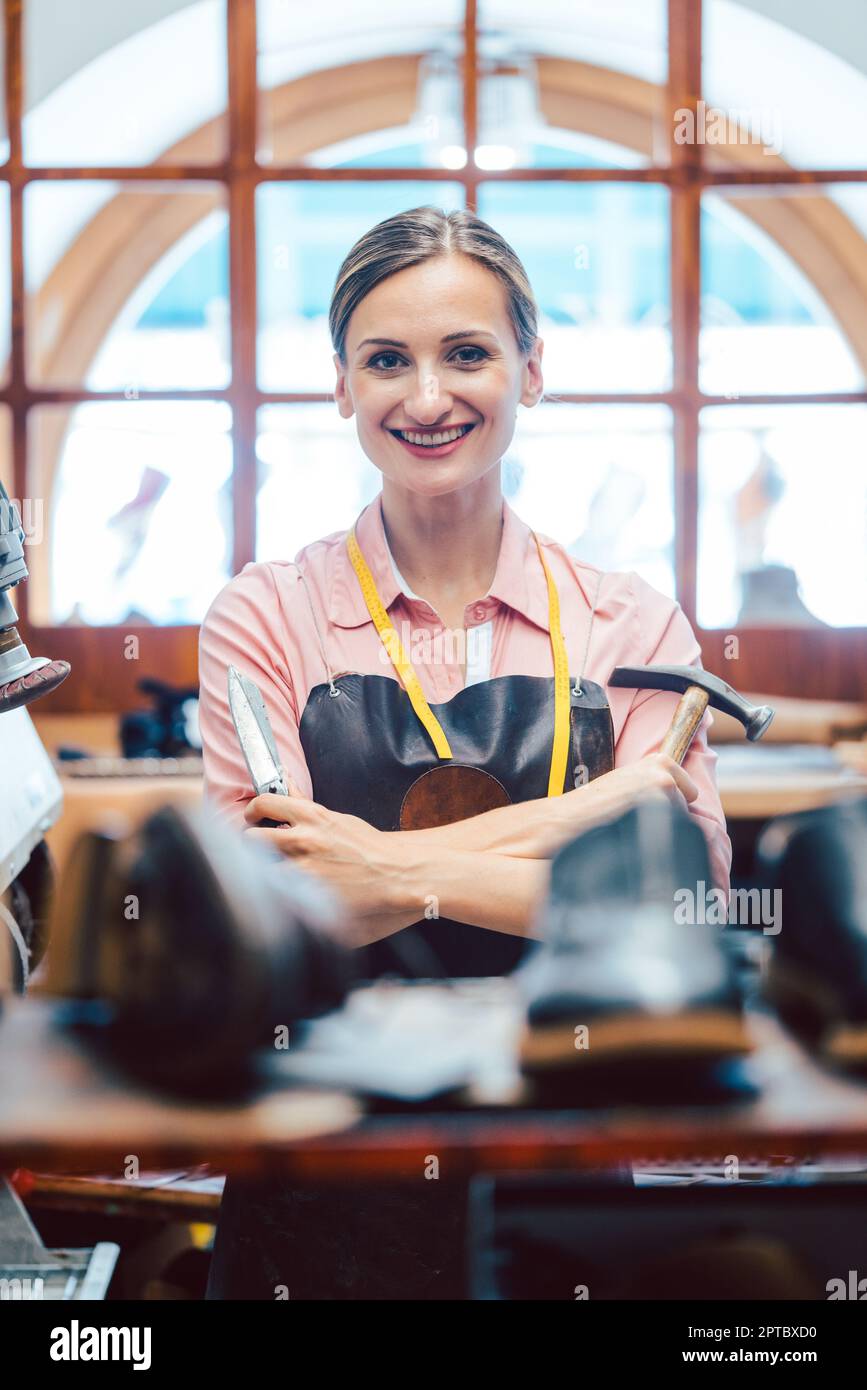 Business portrait of proud owner in her small cobbler workshop Stock ...