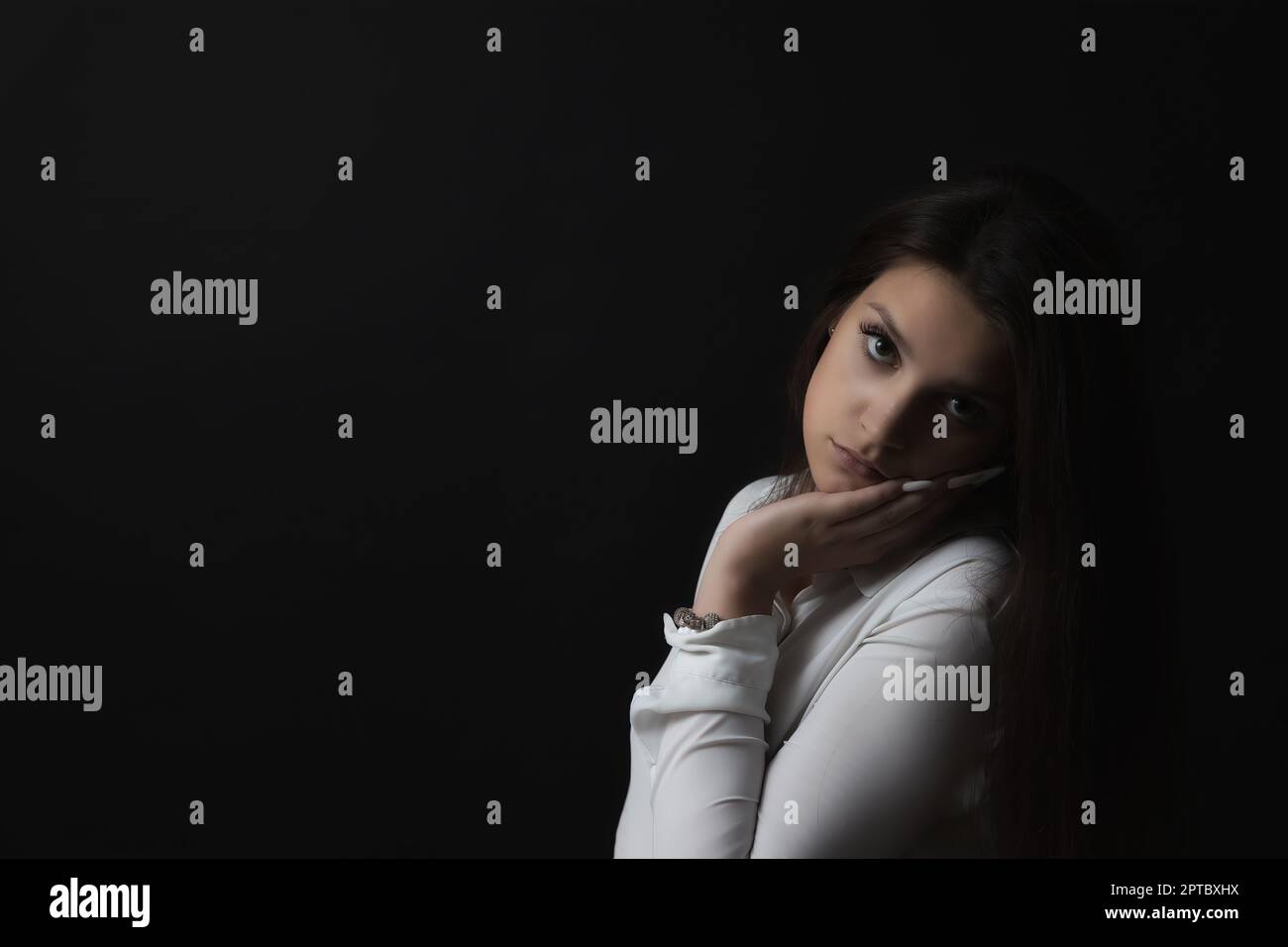 Sad girl in low key portrait. Horizontally Stock Photo - Alamy