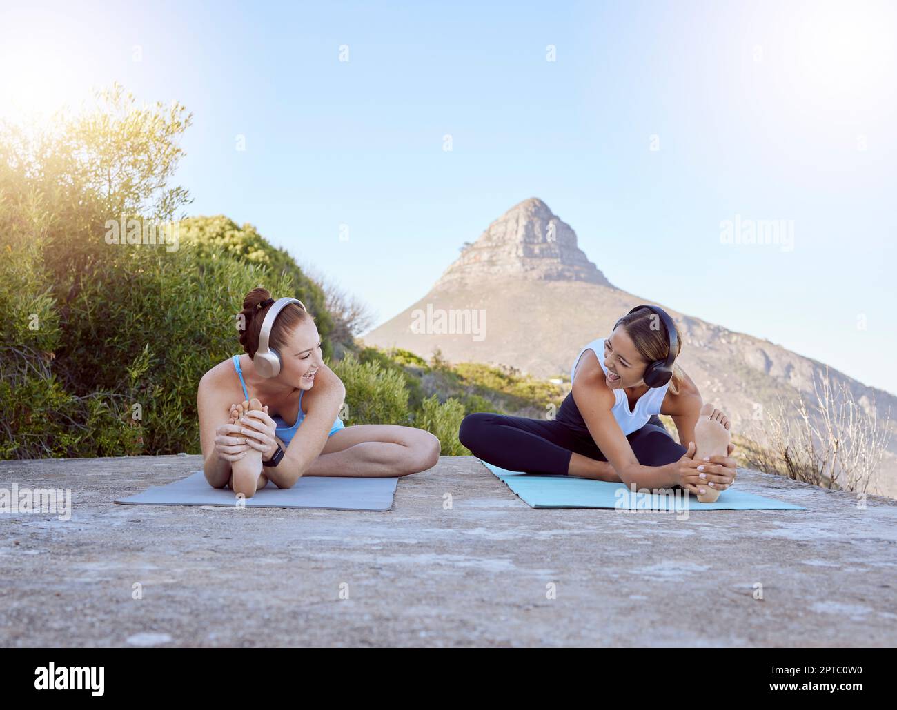Yoga, friends and nature with a sports woman and female athlete ...