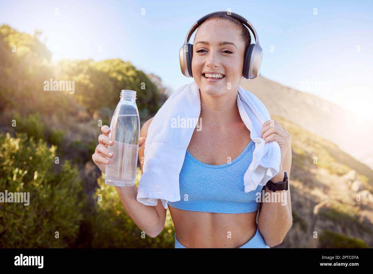 Headphones, nature workout and music streaming of a happy woman after ...