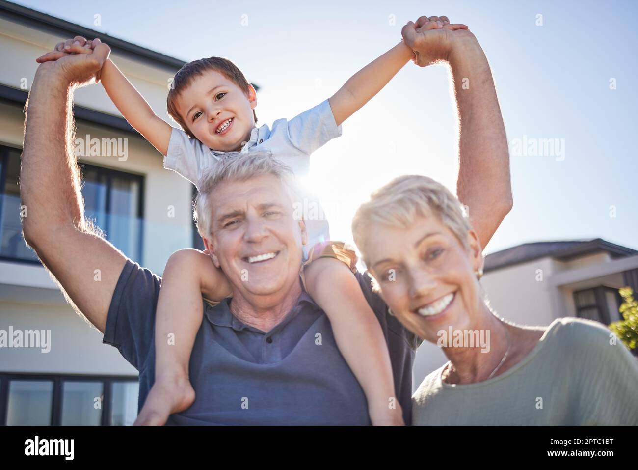 Happy grandparents, smile with child outside home and relax in ...