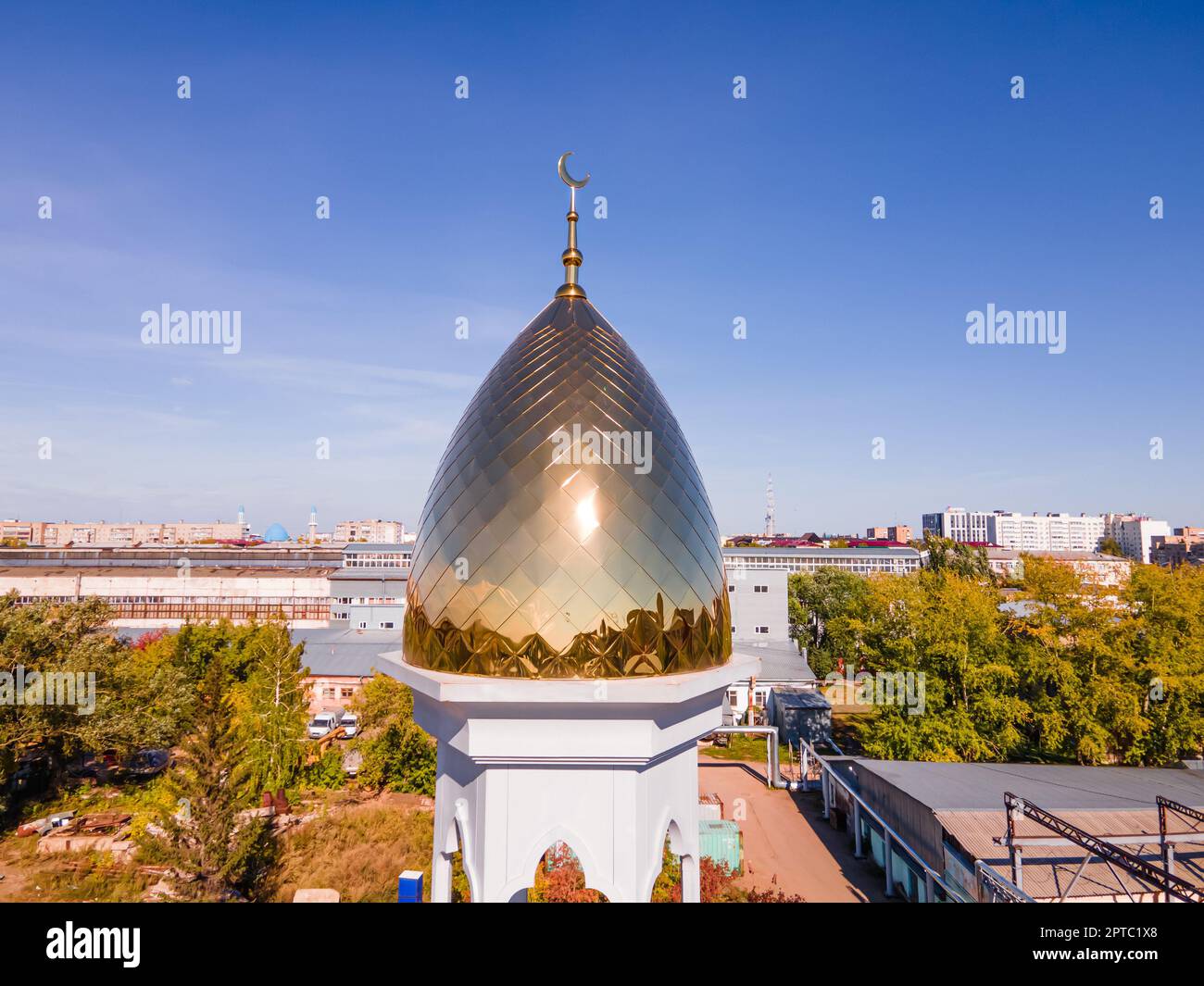A Muslim golden dome with a crescent moon on the mosque. Minaret ...