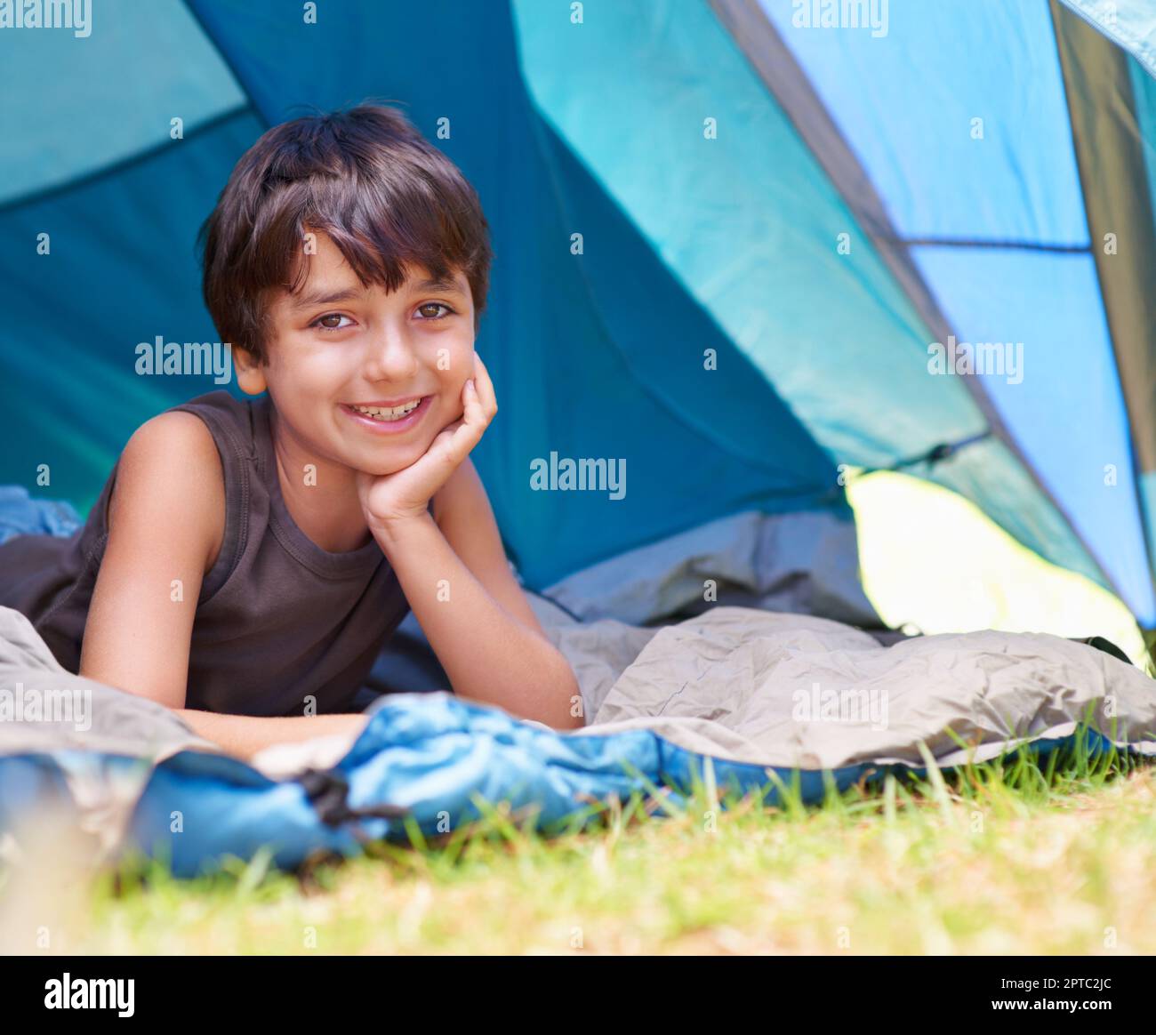 Imagining himself as the next Bear Grylls...Portrait of a young boy ...
