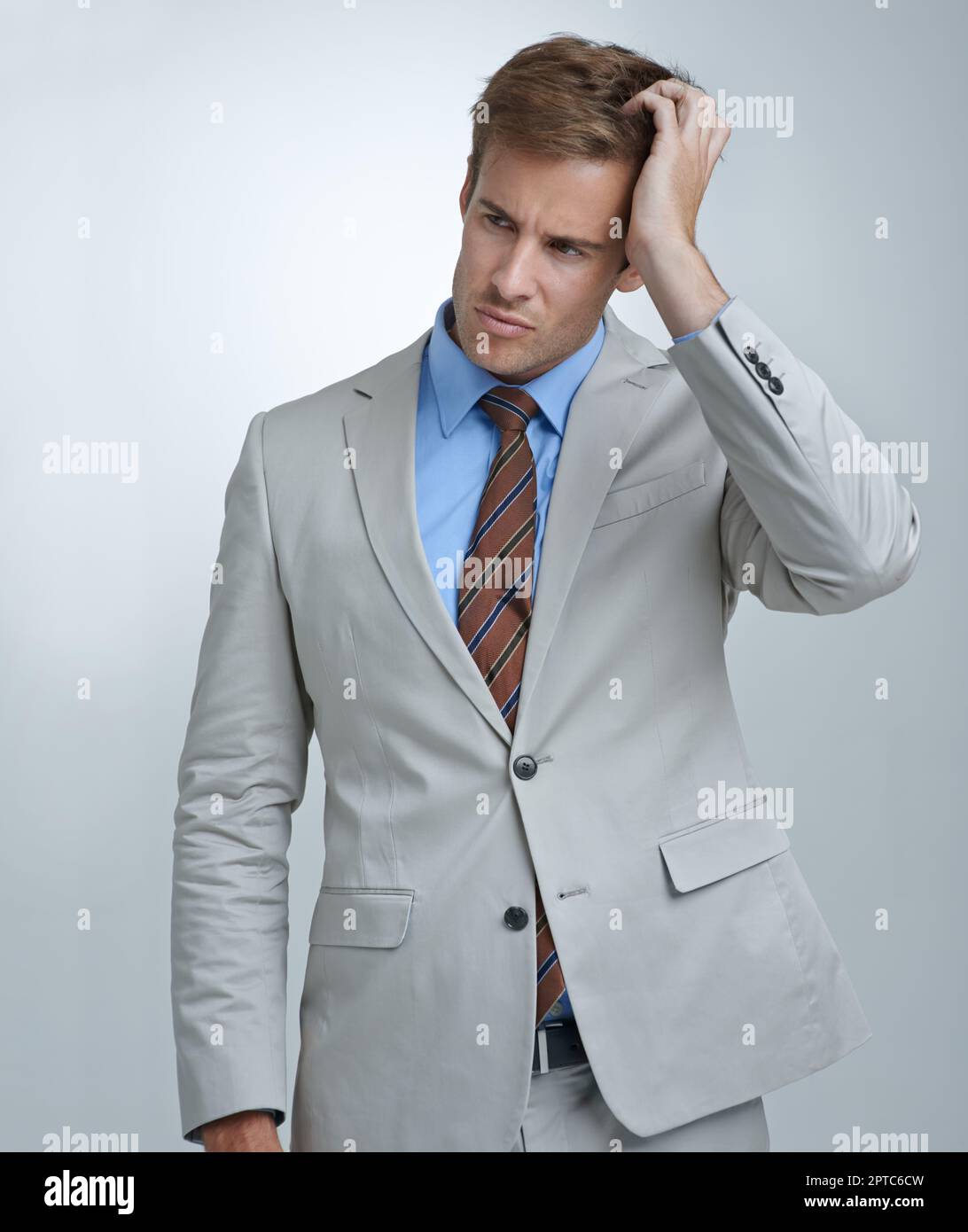 Office worker scratching head hi-res stock photography and images - Alamy