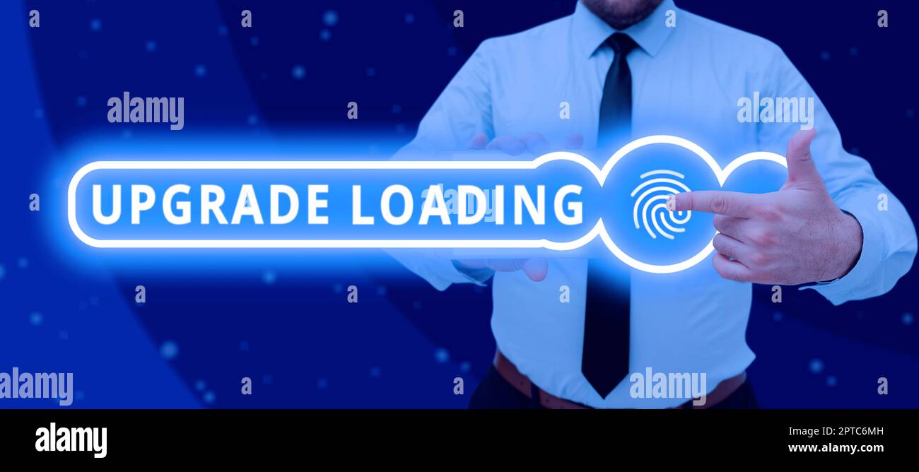 Hand writing sign Upgrade Loading, Word for advancement of applications to more improved tools ...