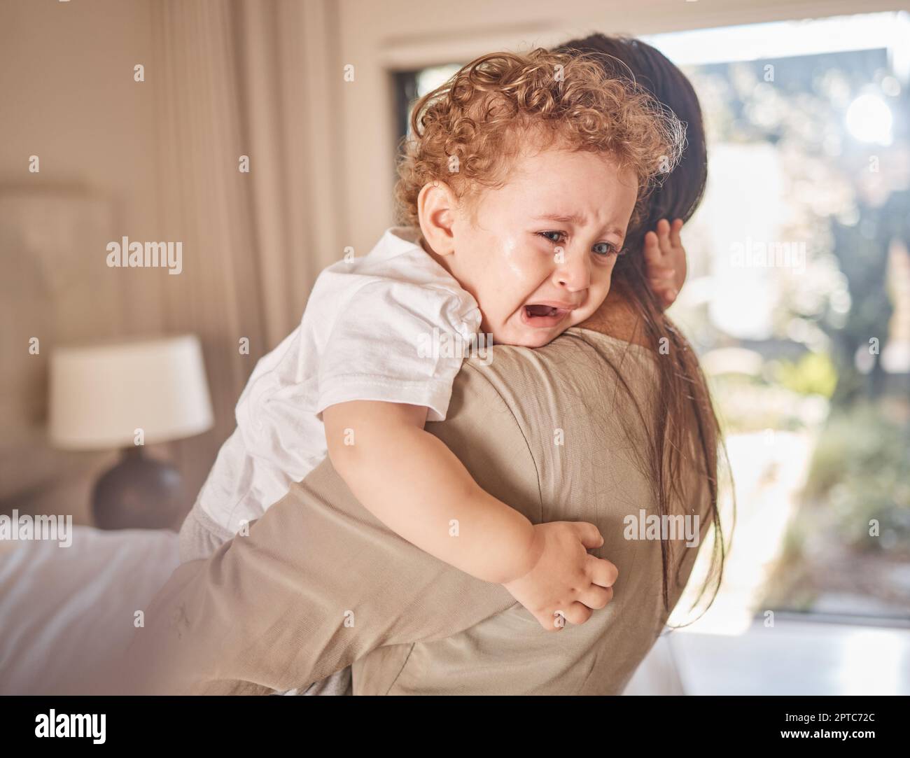 Crying, sad and tears of baby with mom for comfort, safety and ...