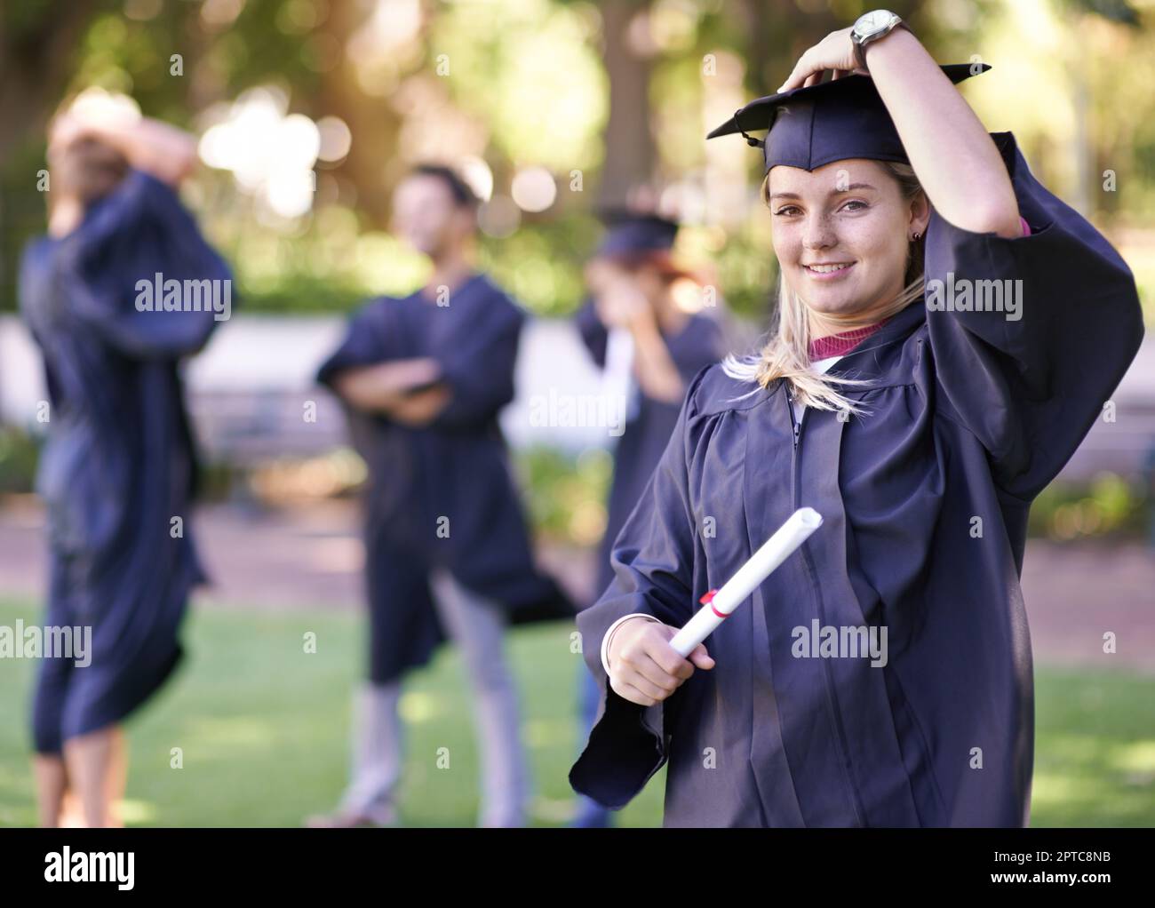 Ready to conquer the real world. Portrait of a smiling graduate holding ...