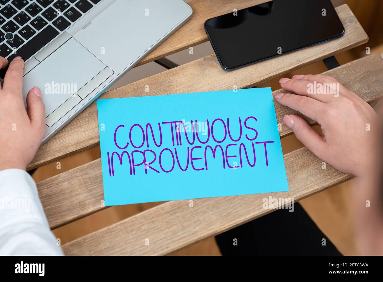 Handwriting text Continuous Improvement, Conceptual photo making small ...