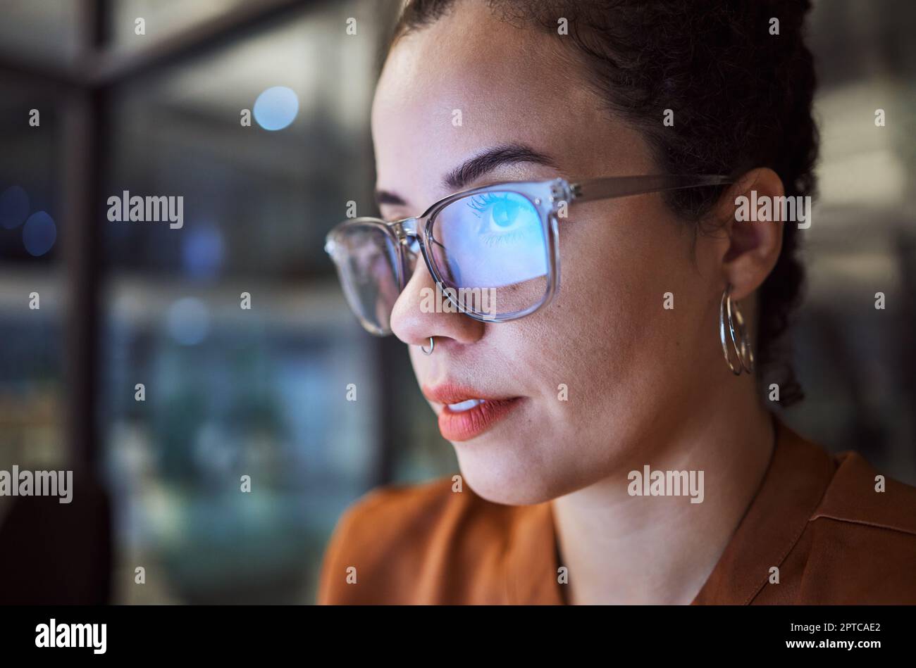 Night business woman with computer on glasses reflection for company innovation or eyes ...