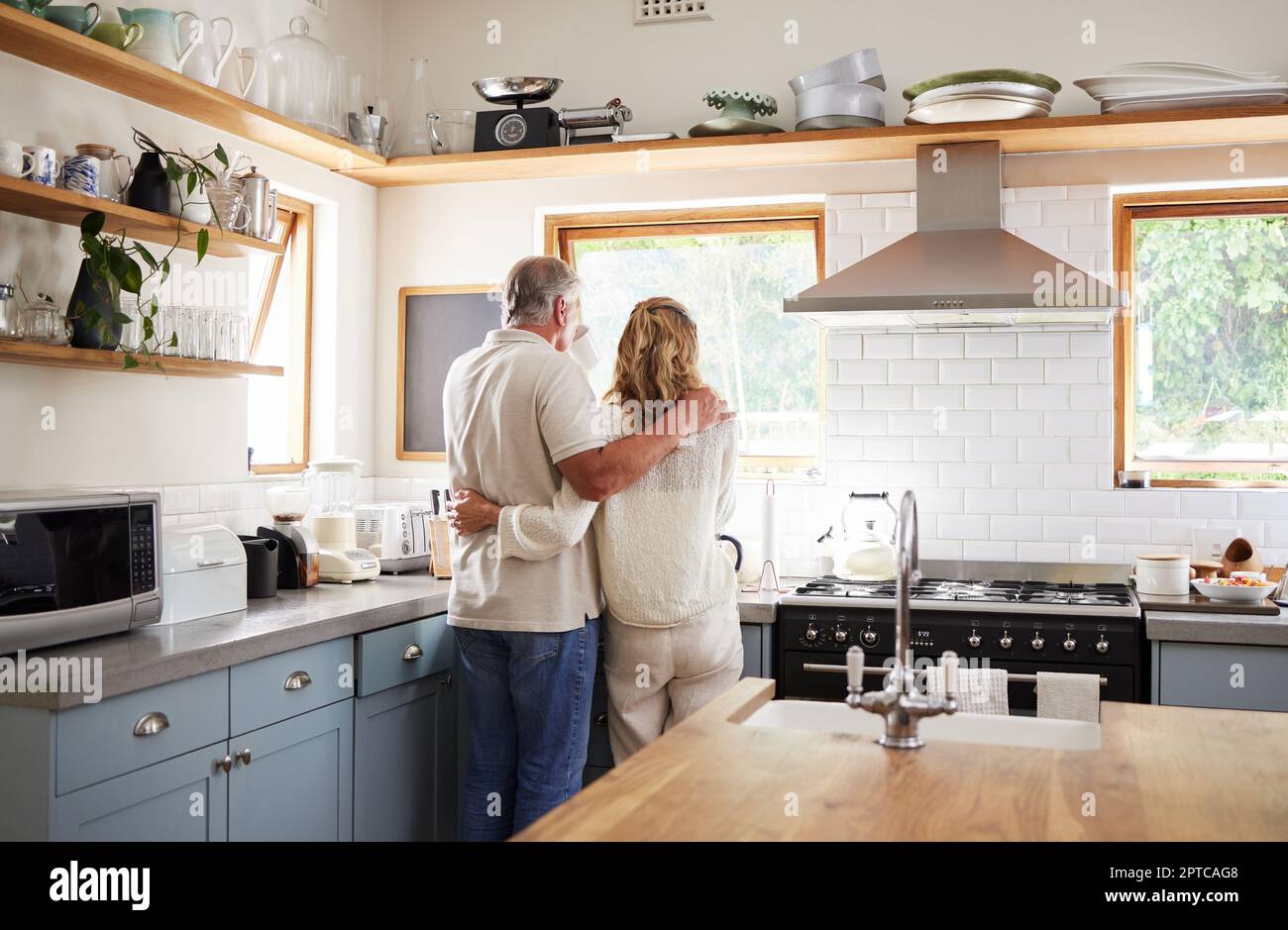 Couple hug, morning coffee and senior people having breakfast in the ...