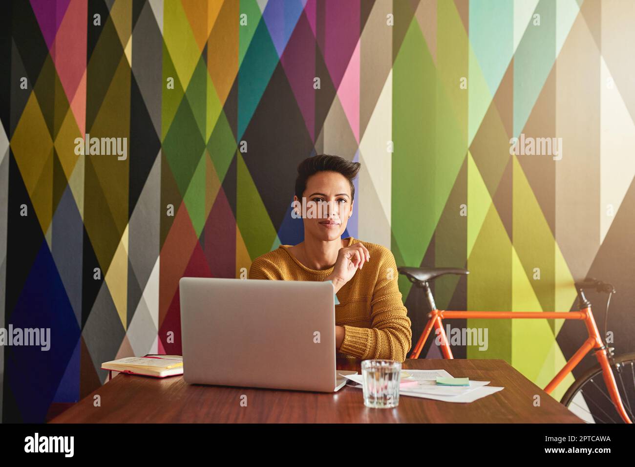 Where she feels most comfortable. a creative employee working in a ...