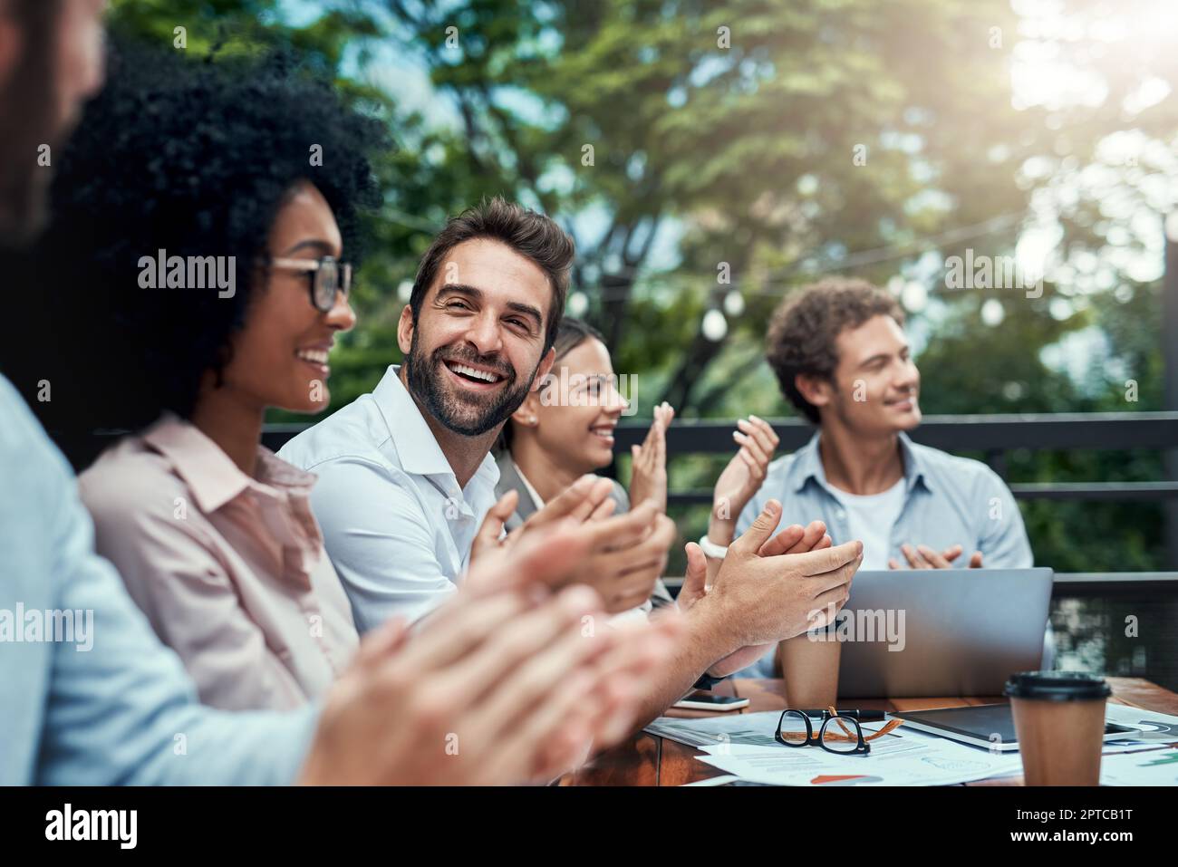 Celebrating another great success. a group of colleagues applauding ...