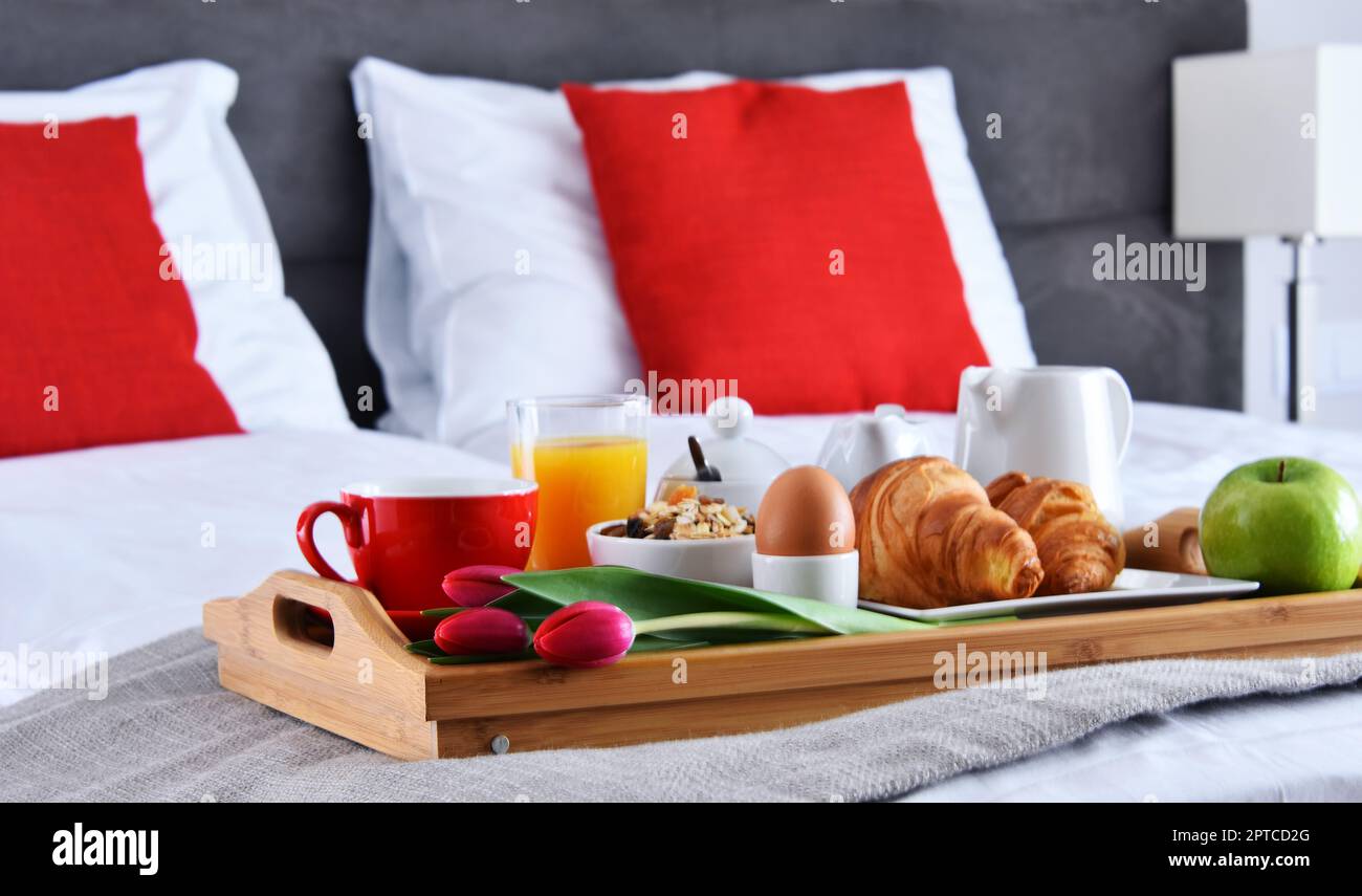Breakfast on tray in bed in hotel room Stock Photo - Alamy