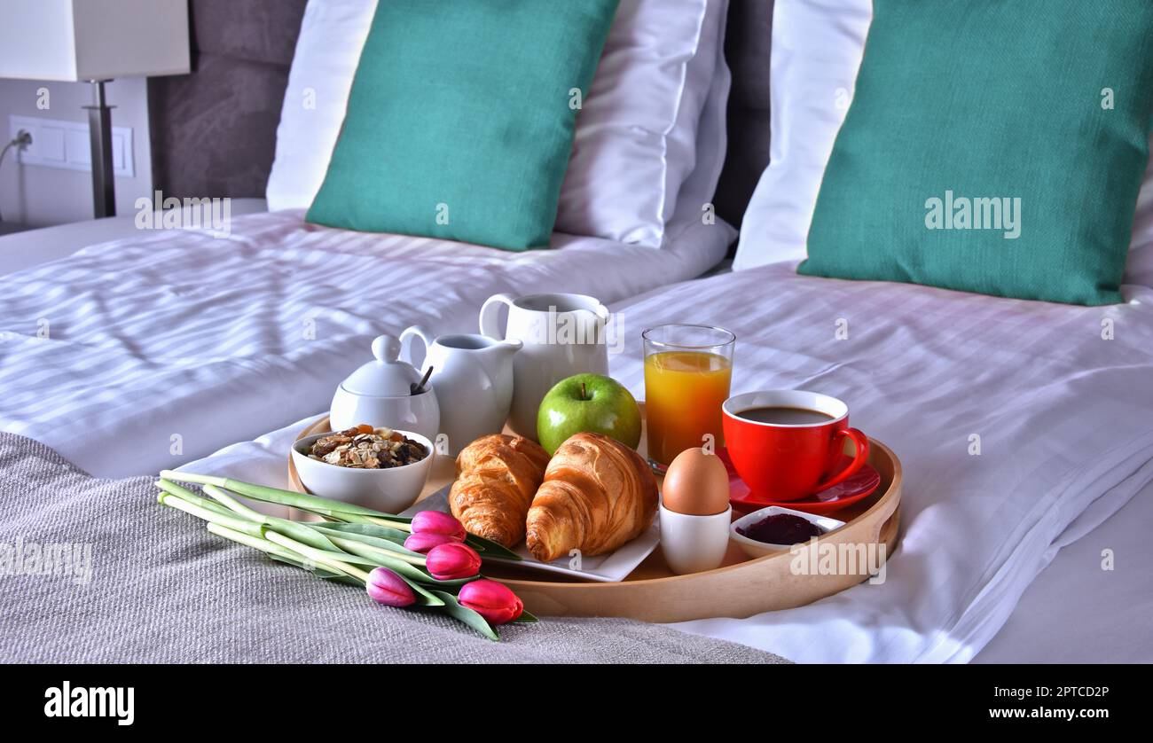 Breakfast on tray in bed in hotel room Stock Photo - Alamy