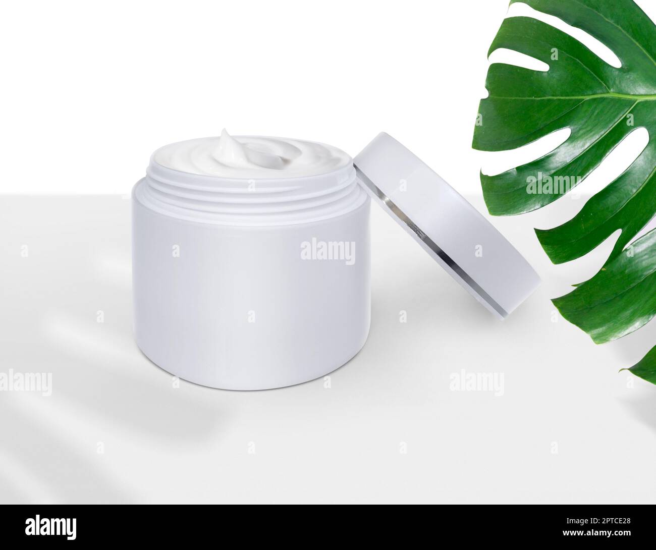Luxury skin care product ad, of Cosmetic cream with monstera leaf Stock ...