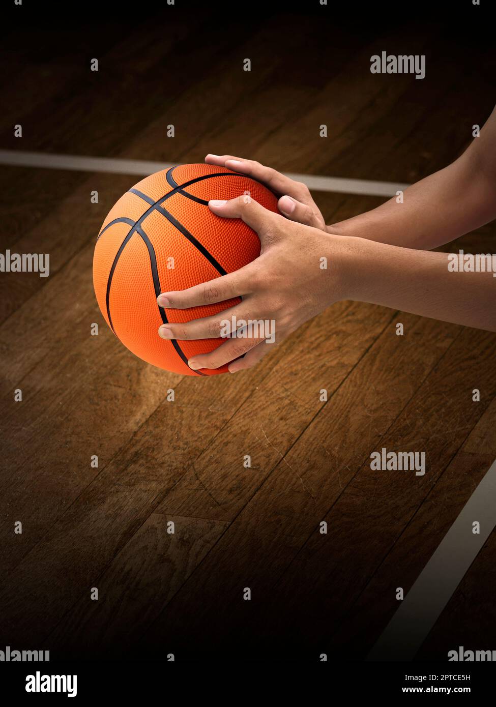 basketball ball in man's hand Stock Photo - Alamy