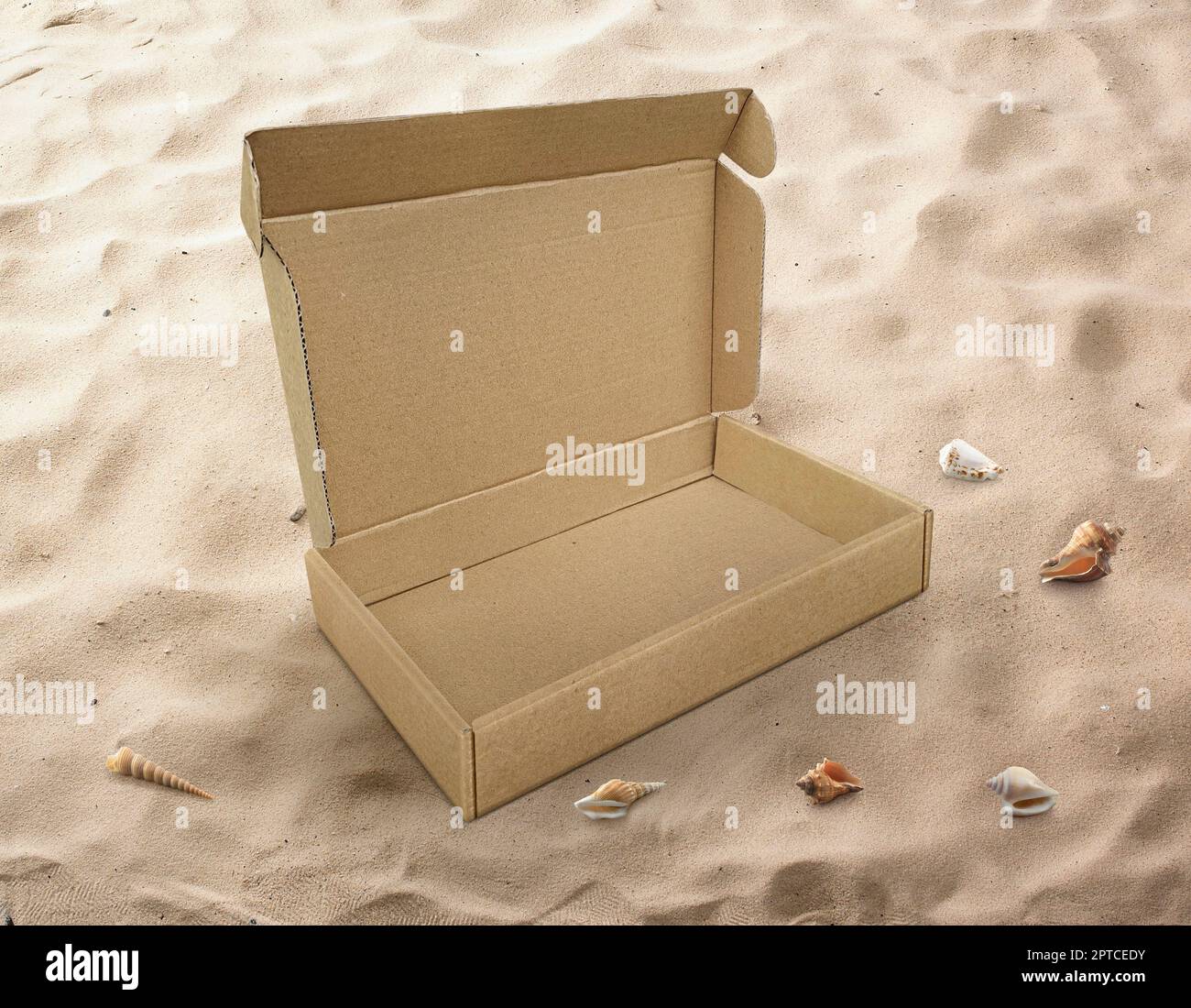Brown cardboard box On The Beach With Sun Beam Stock Photo - Alamy