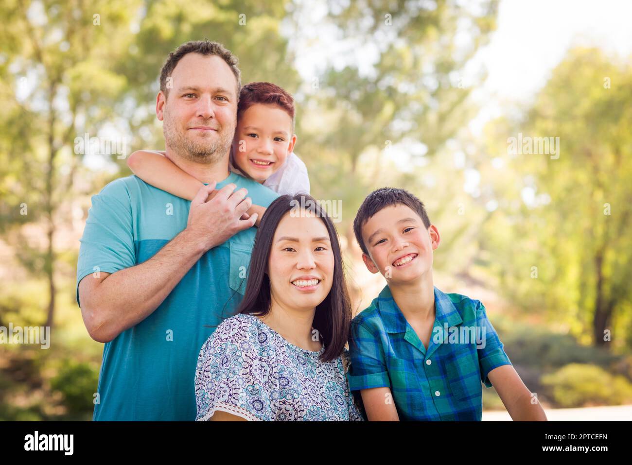 Outdoor portrait of biracial Chinese and Caucasian family Stock Photo ...